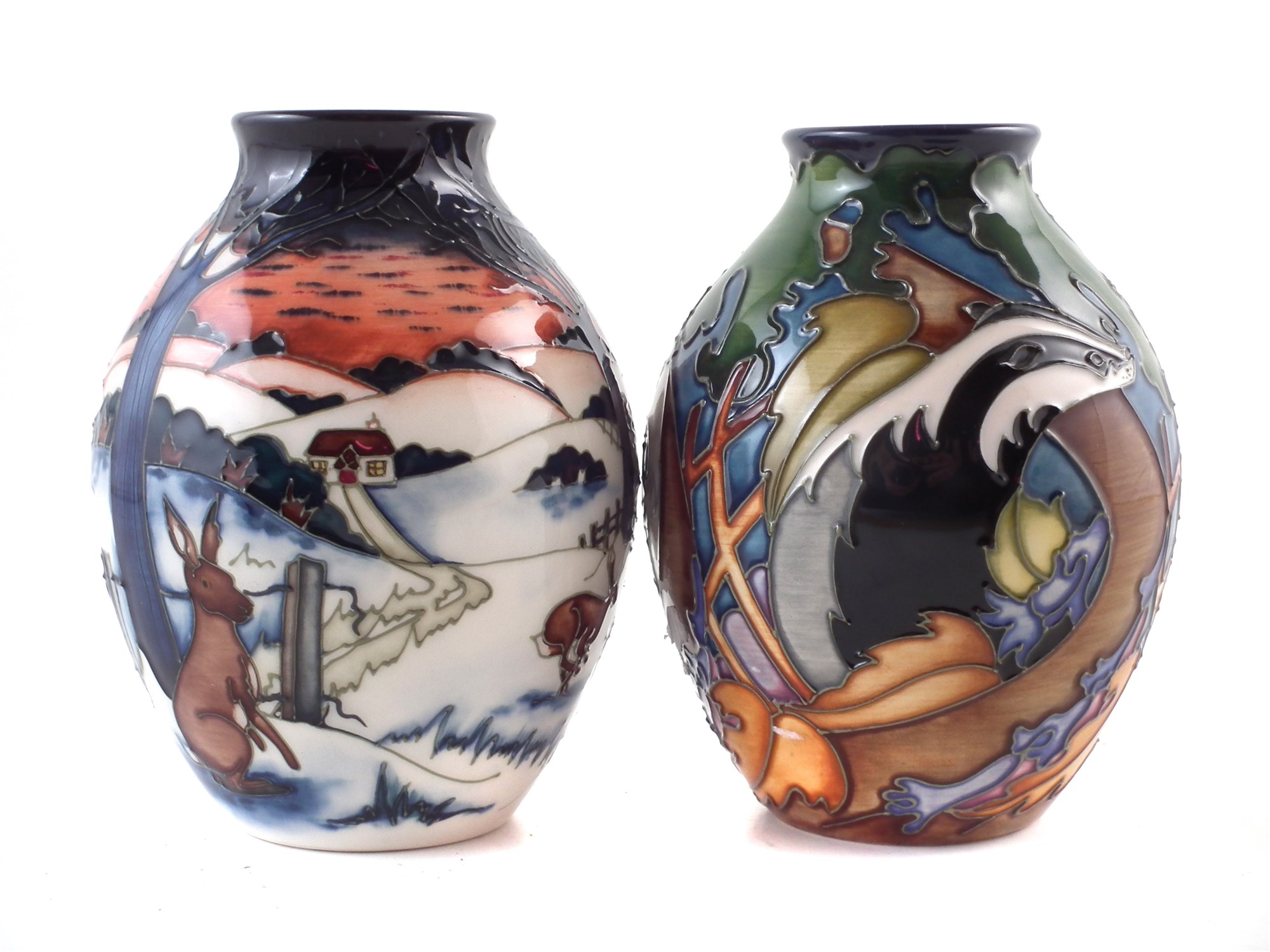 Two small Moorcroft vases one decorated with badgers the other with ...