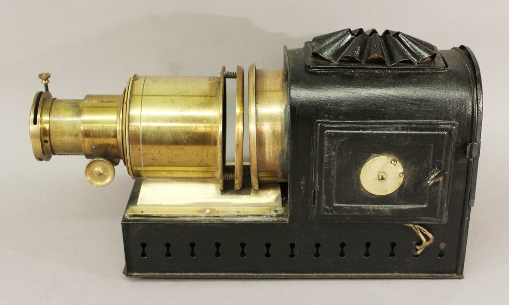 A LATE 19TH/EARLY 20TH CENTURY MAGIC LANTERN PROJECTOR with brass lens ...