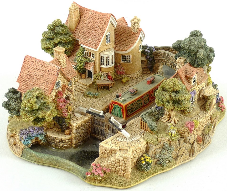 A collection of Lilliput Lane models, including Tranquil Waterways ...