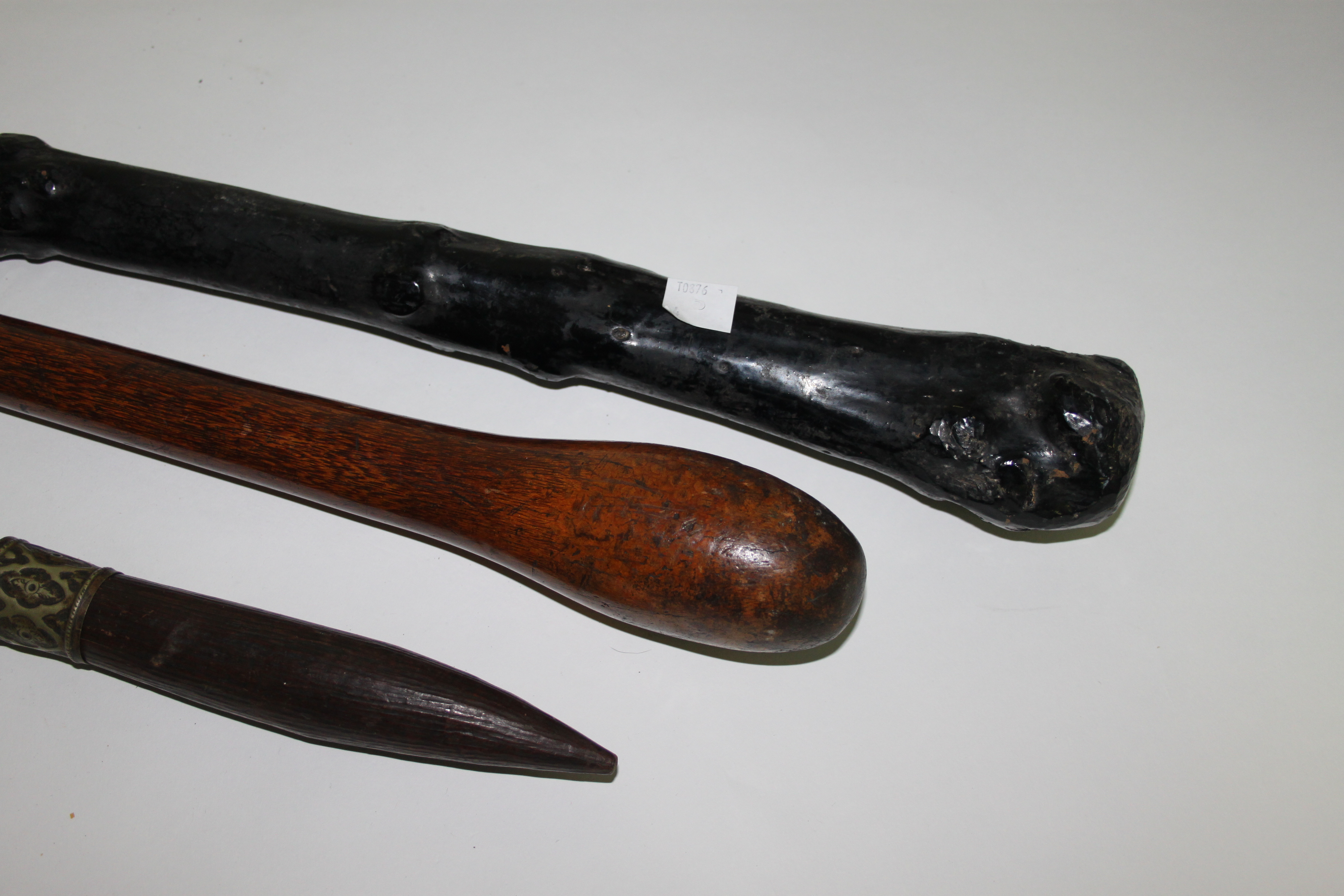 An Australian aboriginal nulla nulla or waddy club, with incised reeded ...