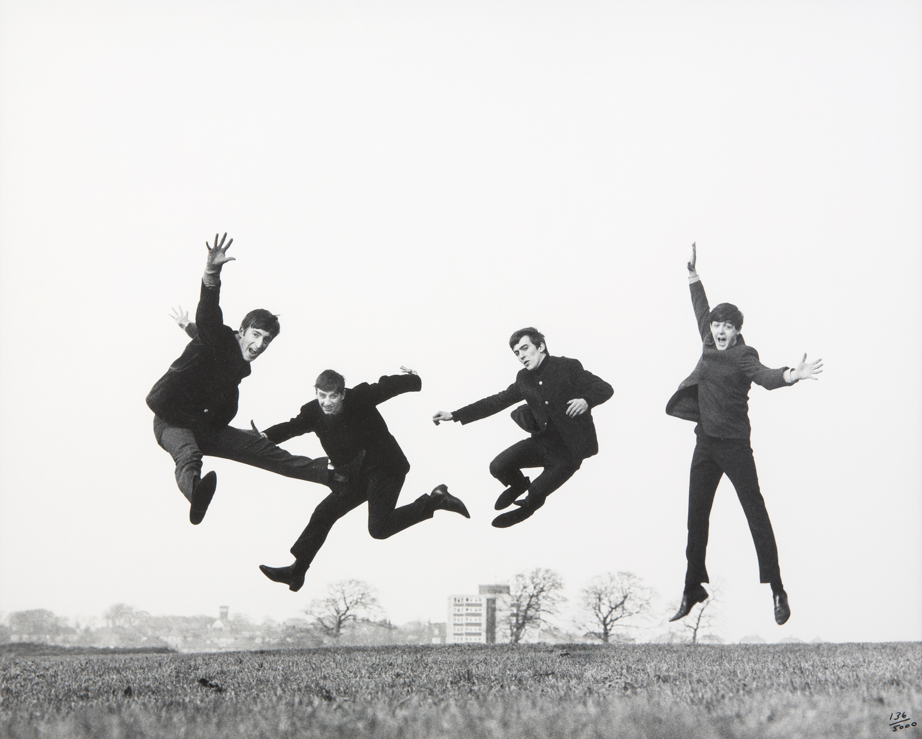 THE BEATLES JUMP POSE PHOTOGRAPH BY DEZO HOFFMAN A black and photograph ...