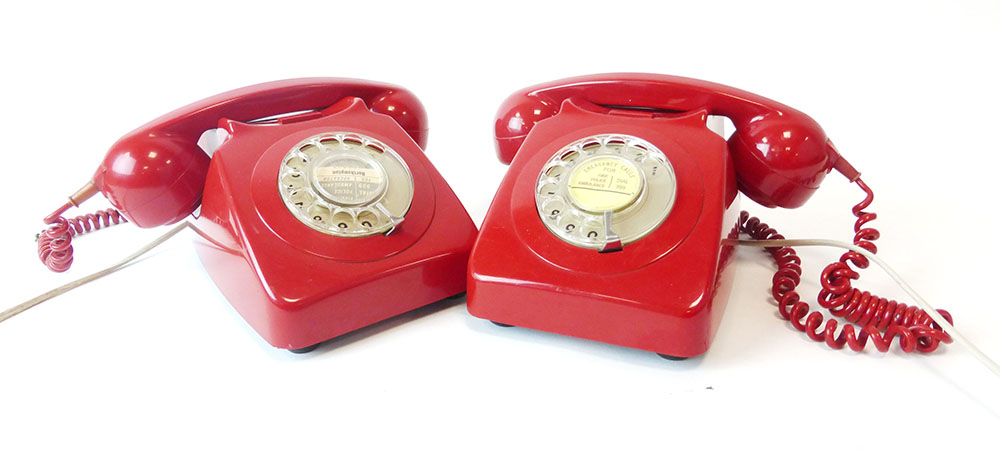 Two 1970's BT telephones with red bakelite cases