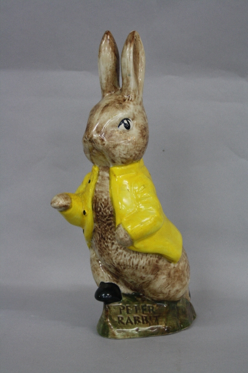 A LARGE SYLVAC WARE 'PETER RABBIT' FIGURE, wearing yellow jacket ...