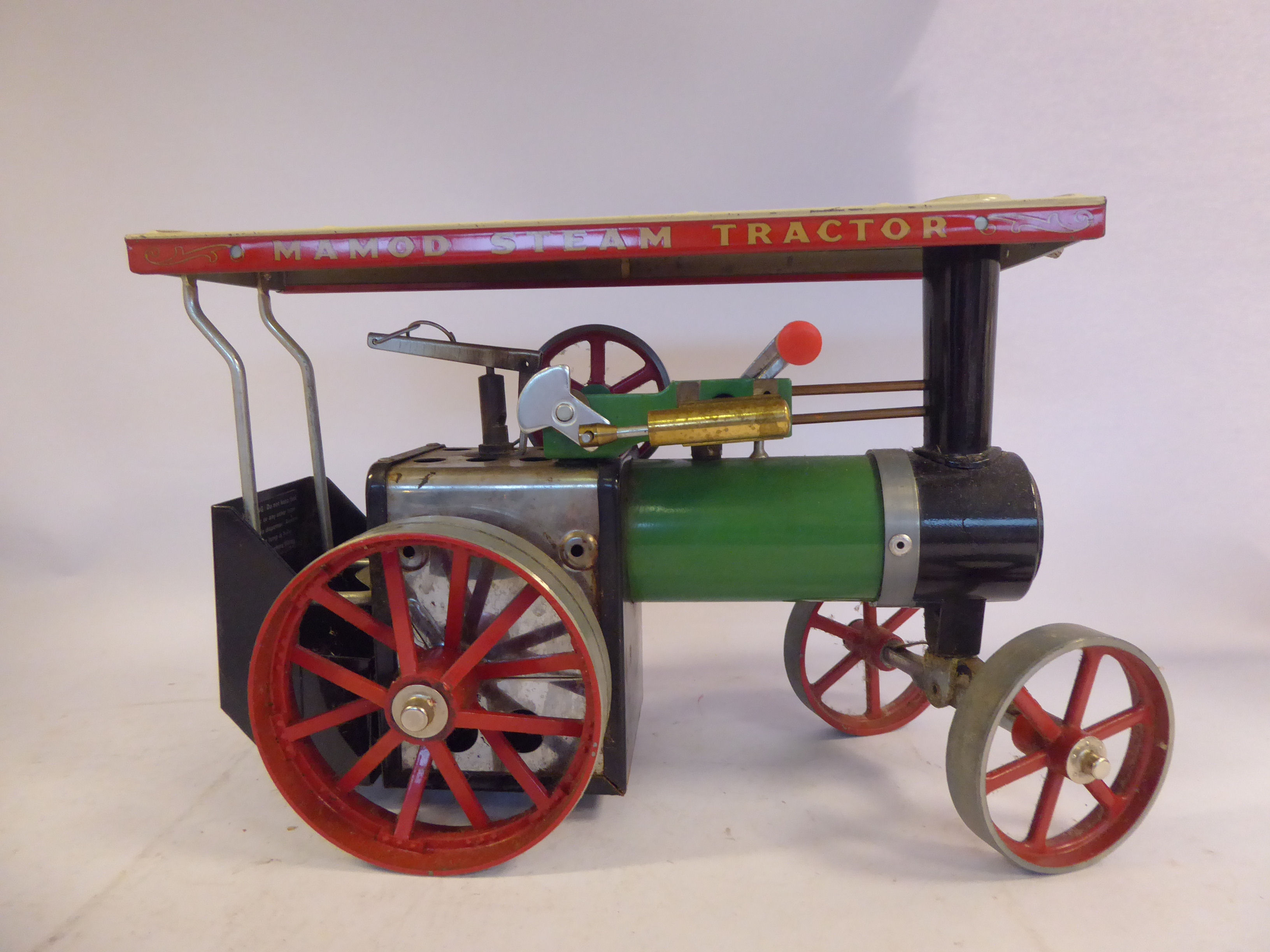A Mamod live steam model traction engine, in green, red, black and ...