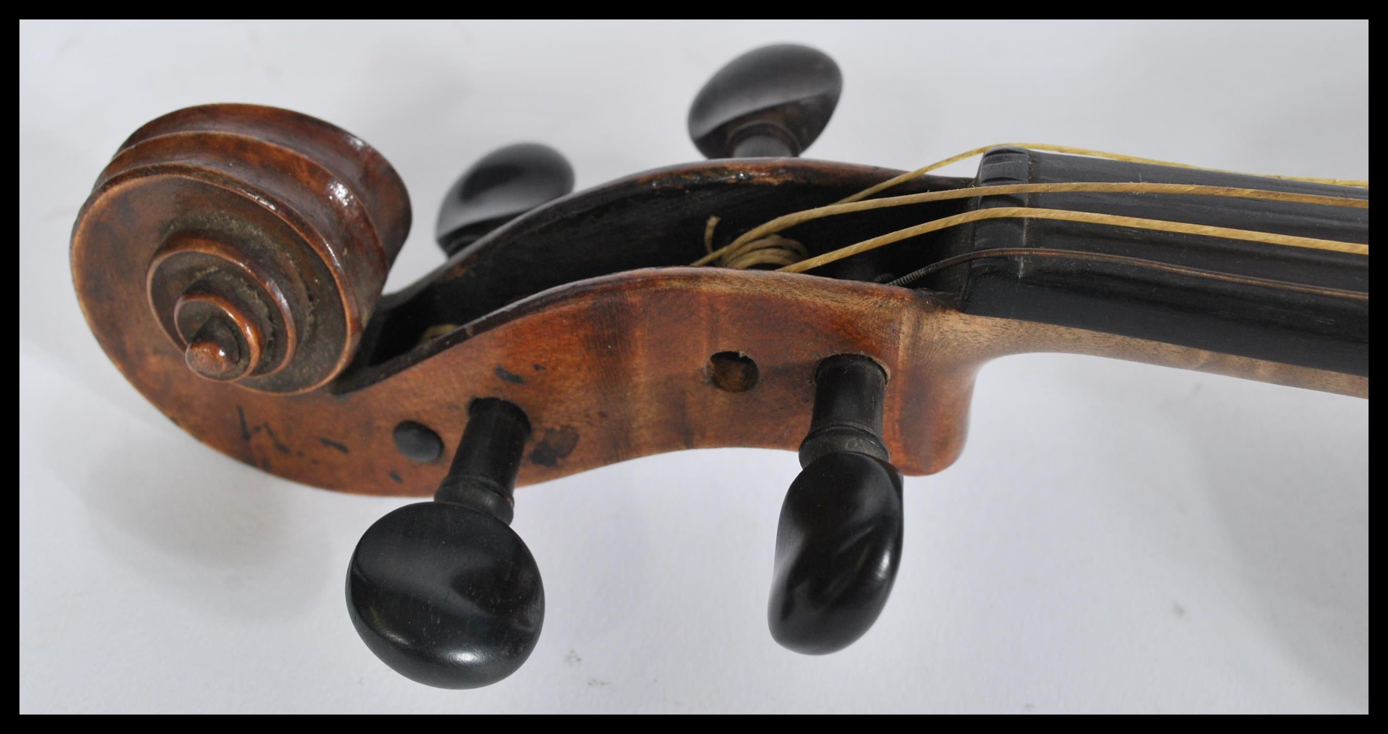 A 19th century Victorian walnut violin with a horse hair bow with ...
