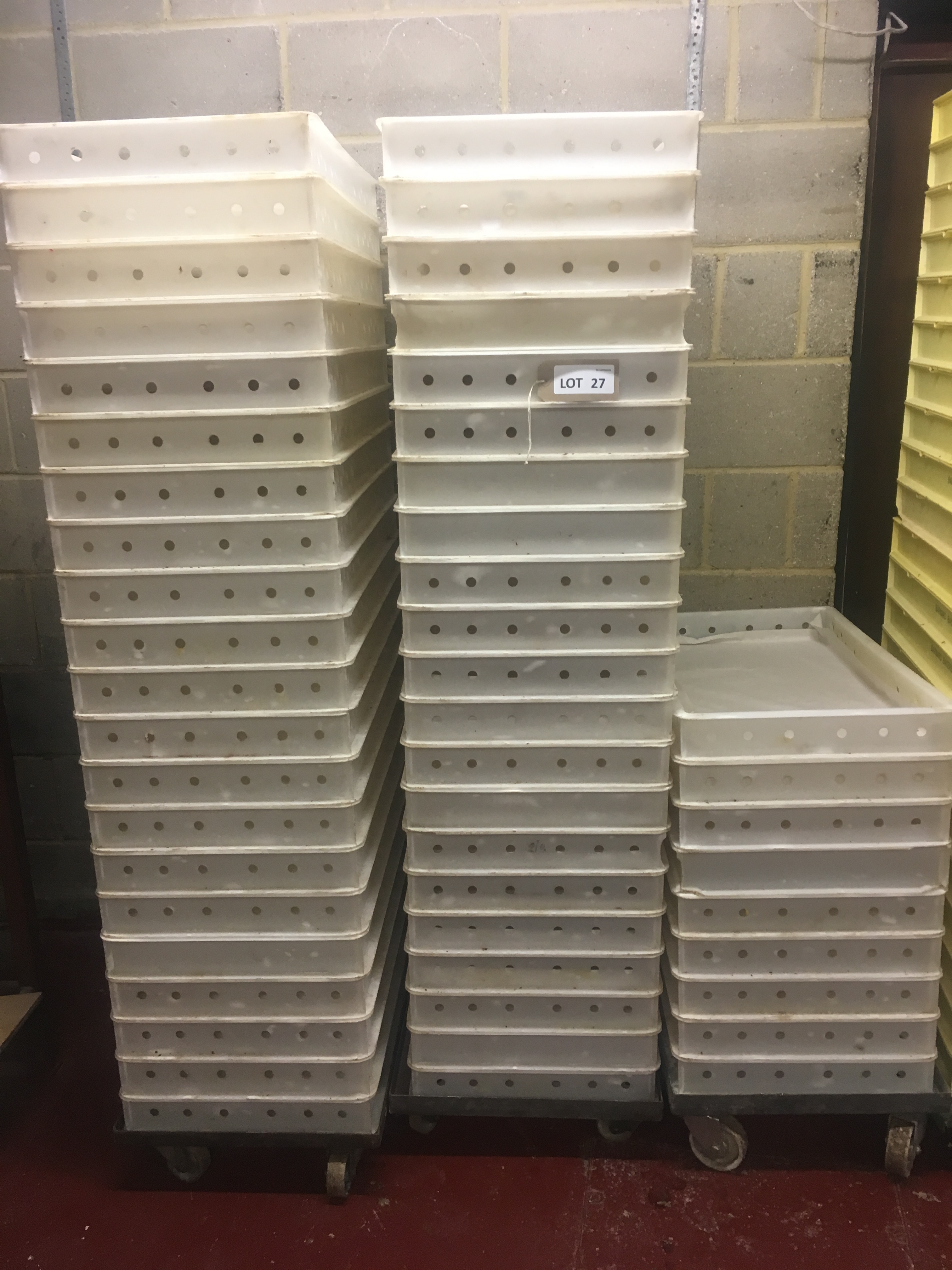 51 x Acrylic stackable pastry trays, freezer type, on 2 steel dollies