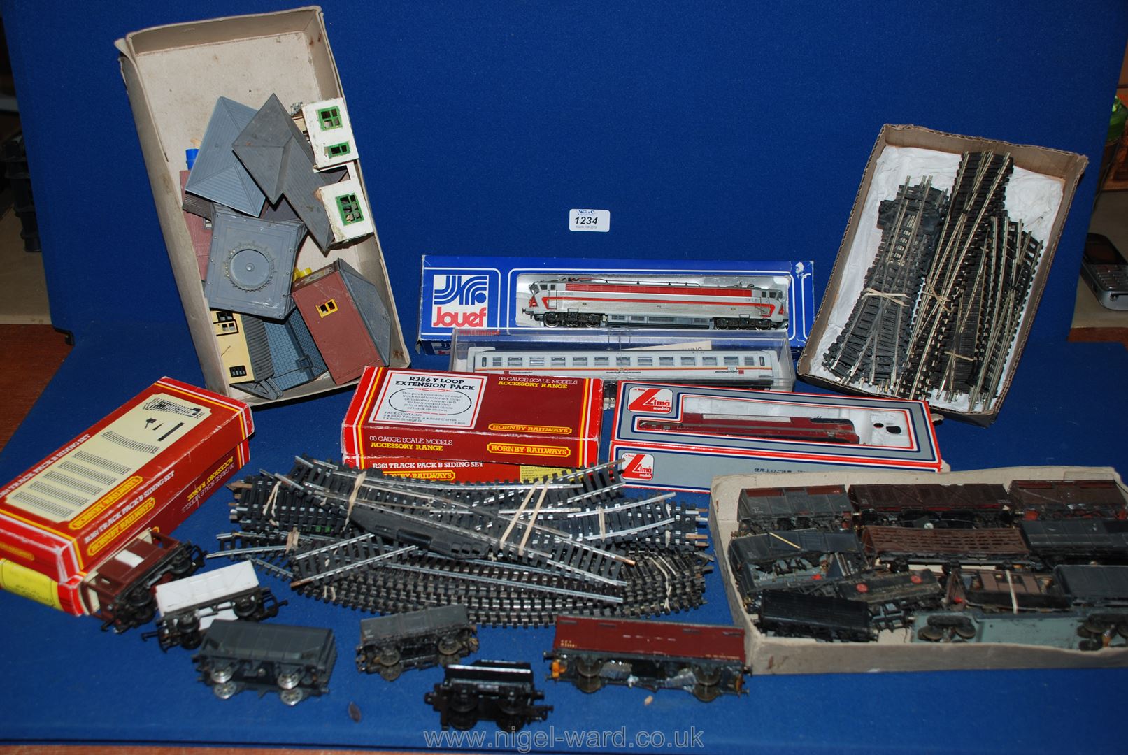 A 00 gauge model railway, including two boxed engines, sixteen wagons ...