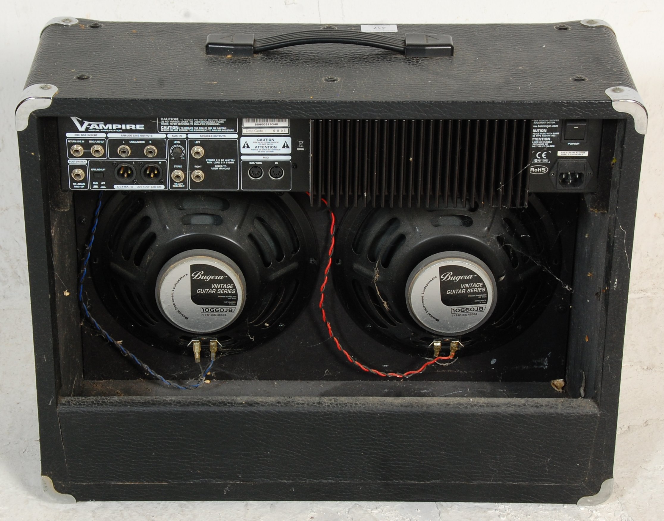 A Behringer V-ampire LX210 electric guitar amplifier having a digital ...