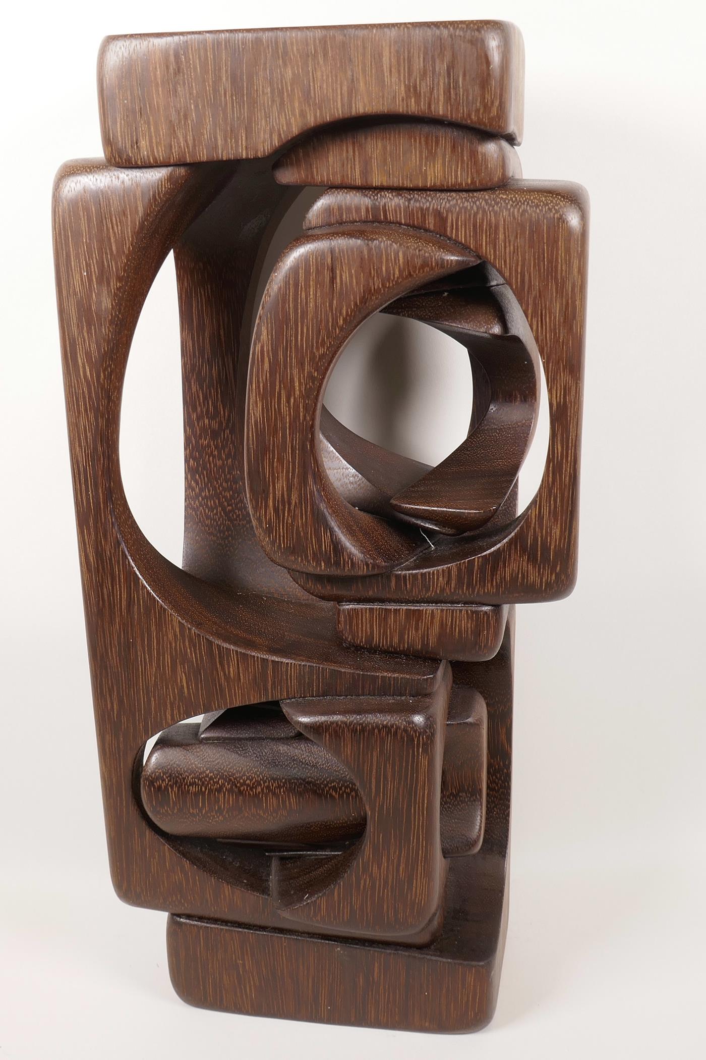 A carved hardwood sculpture in the manner of Brian Wilsher, unsigned ...