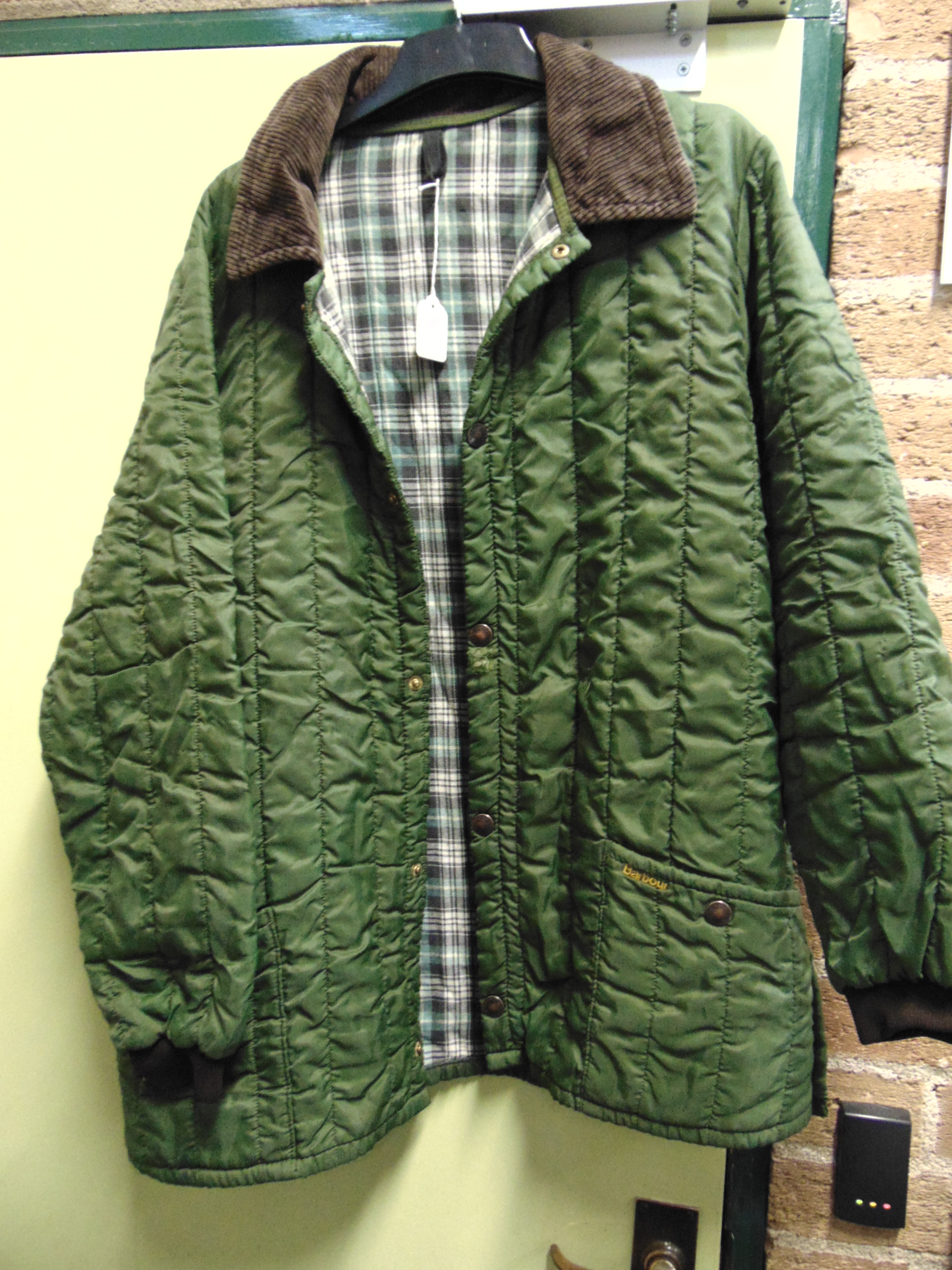 A 'BARBOUR' GREEN QUILTED JACKET with brown cord collar, size medium; a ...