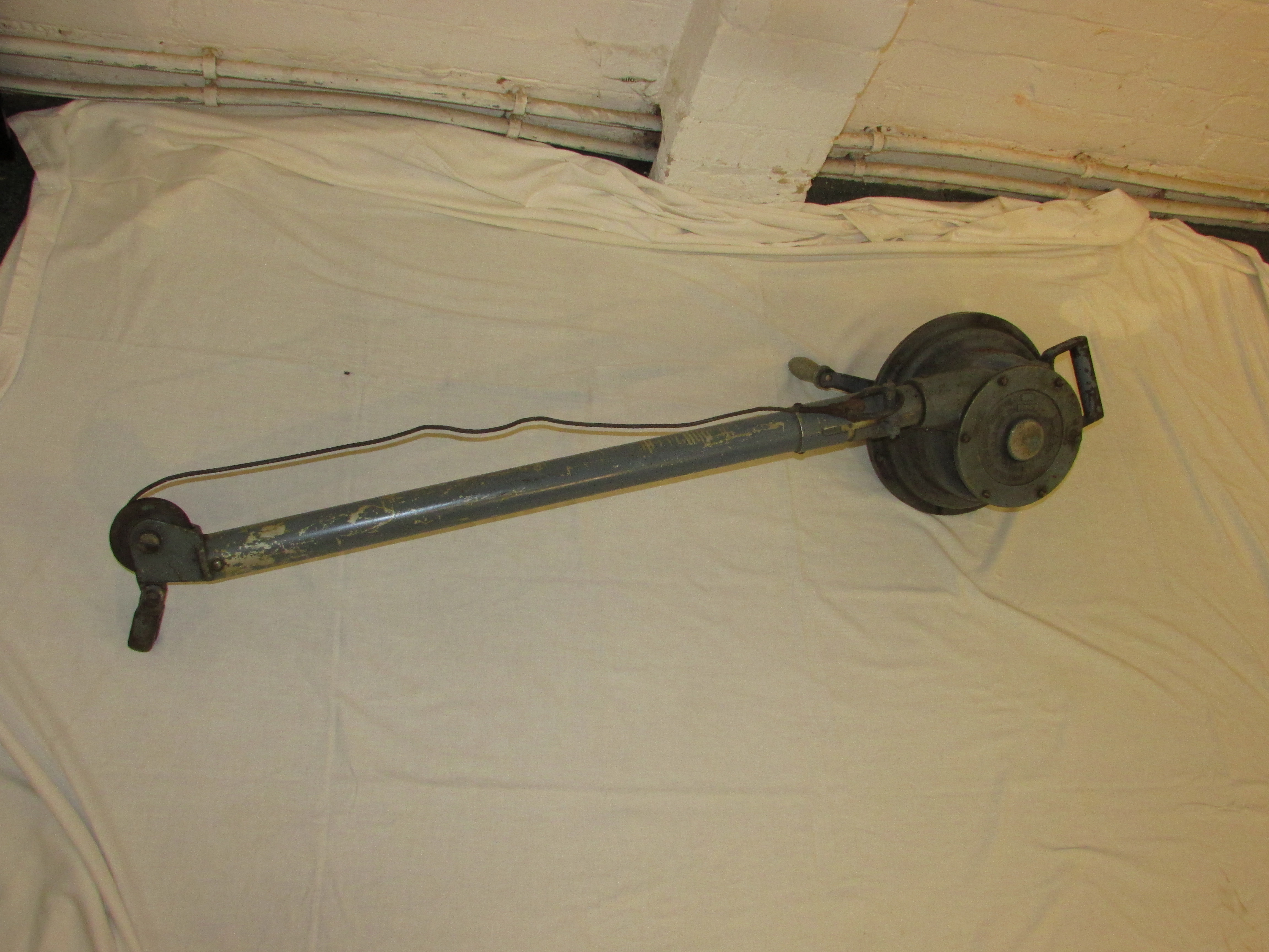 WW II US bomb hoist, metal painted grey, marked U.S Navy BU. OF ORD ...