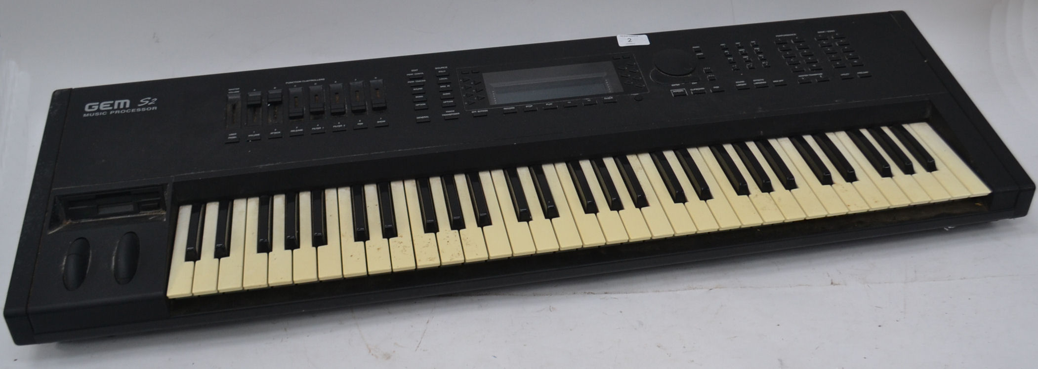 A General Music GEM S2 Synthesizer Keyboard / Piano together with a ...