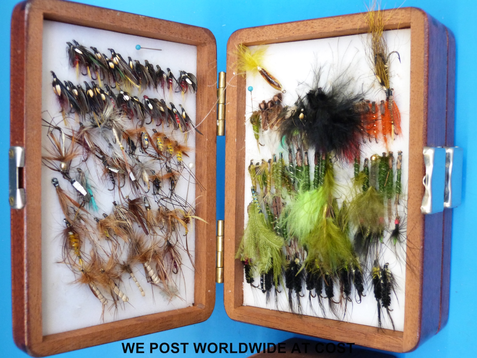 A hinged wooden three tier four compartment fly box full of trout flies ...