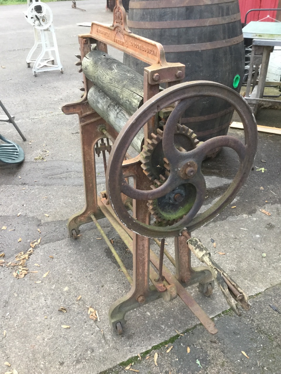 A late Victorian cast iron mangle by Bradford & Co, with crest above ...
