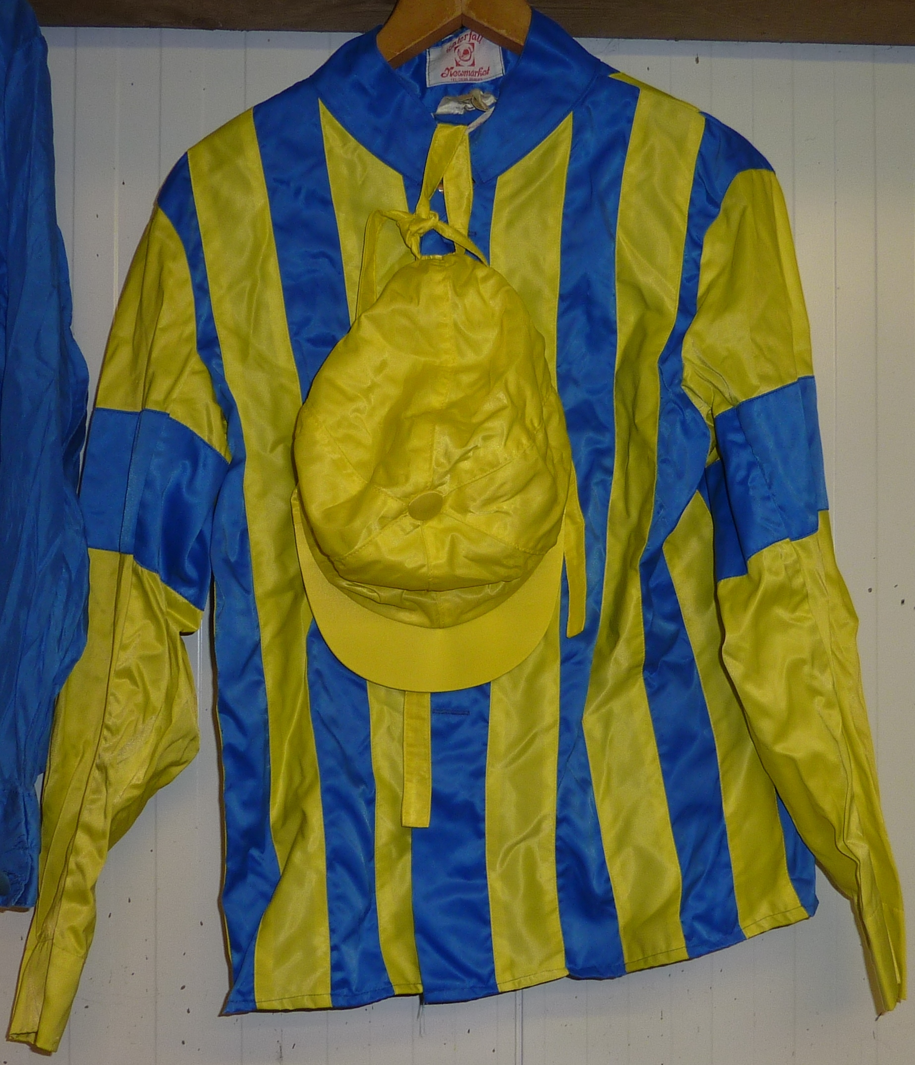 Yellow and royal blue striped horse racing silks/colours including cap ...