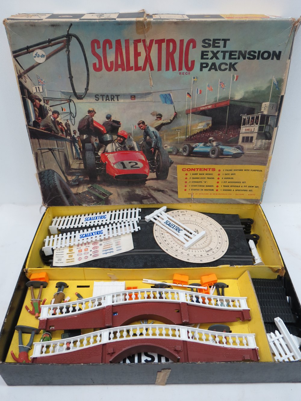 A circa late 1960s Scalextric set extension pack including humpback ...