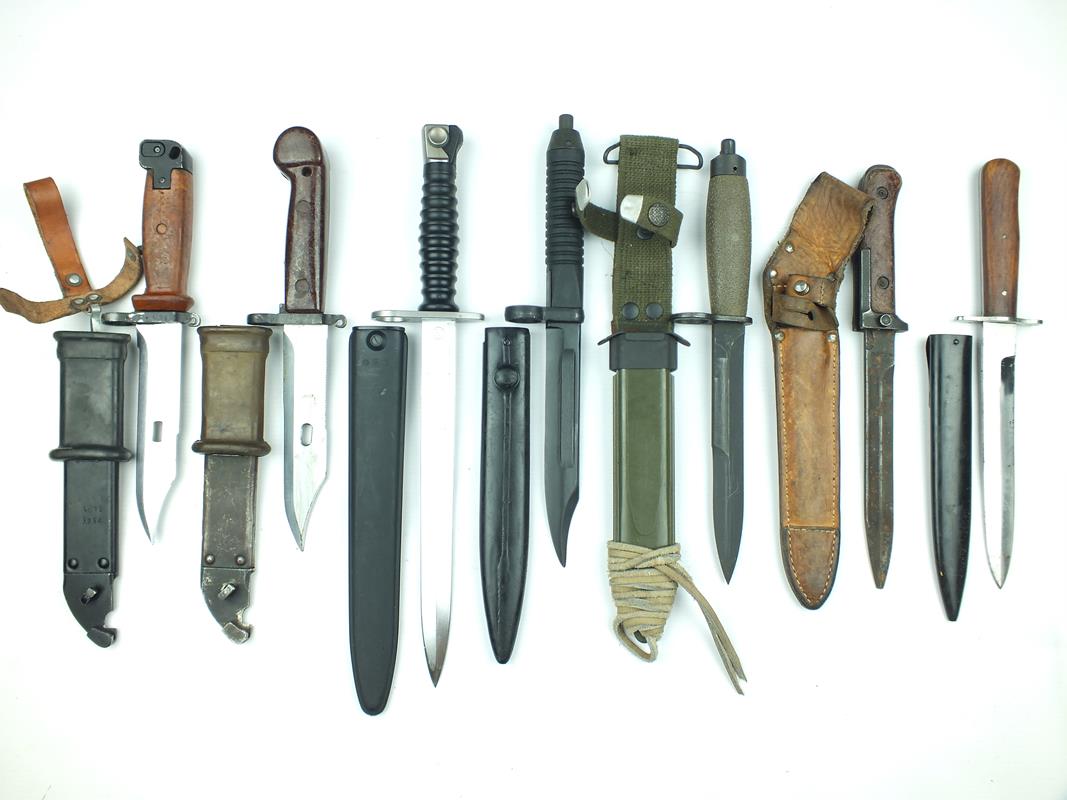 An AKM bayonet, together with another similar, a Swiss Model 1957 ...