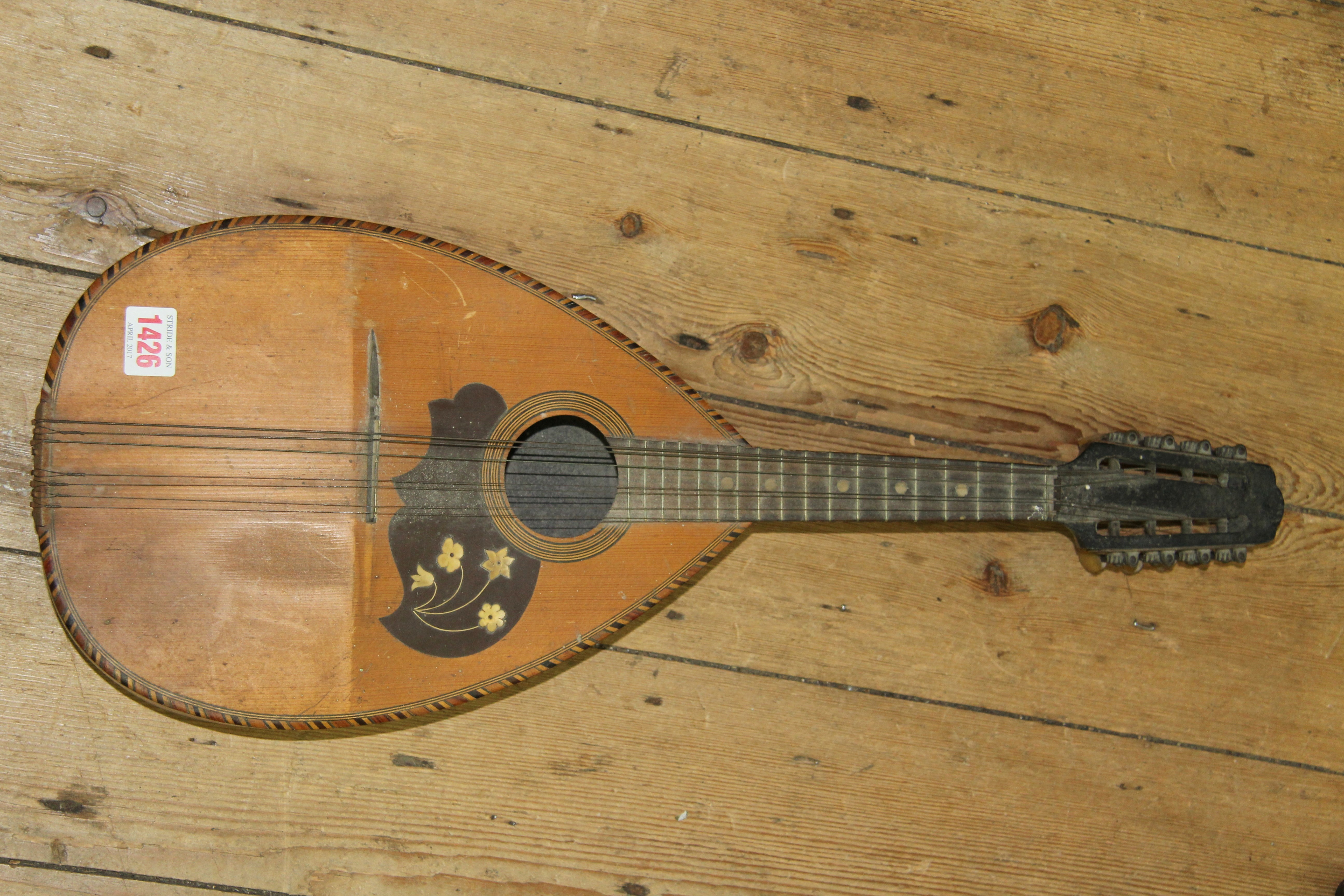 An antique flat back mandolin.