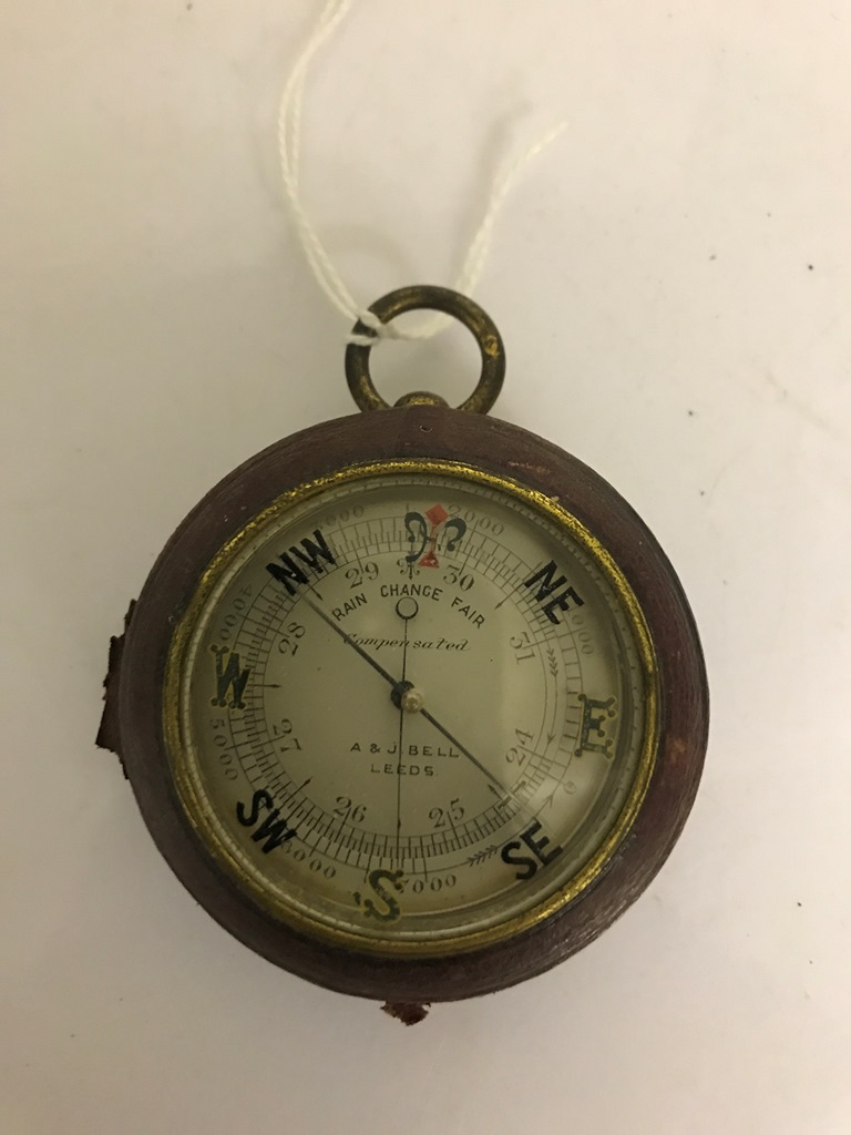 A 19th century cased hand barometer, with compass set to the outer case