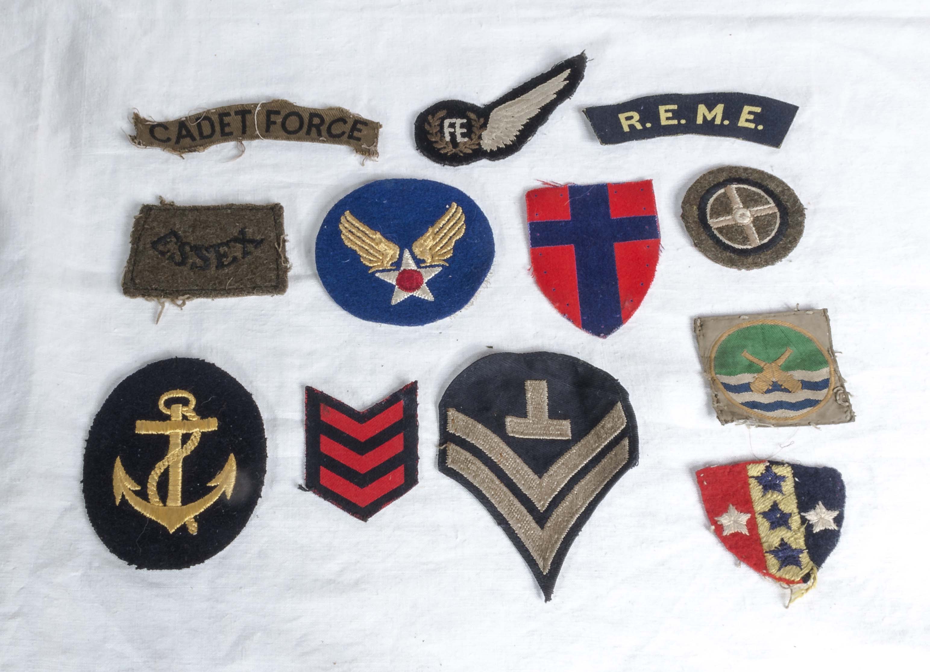 A collection of cloth badges