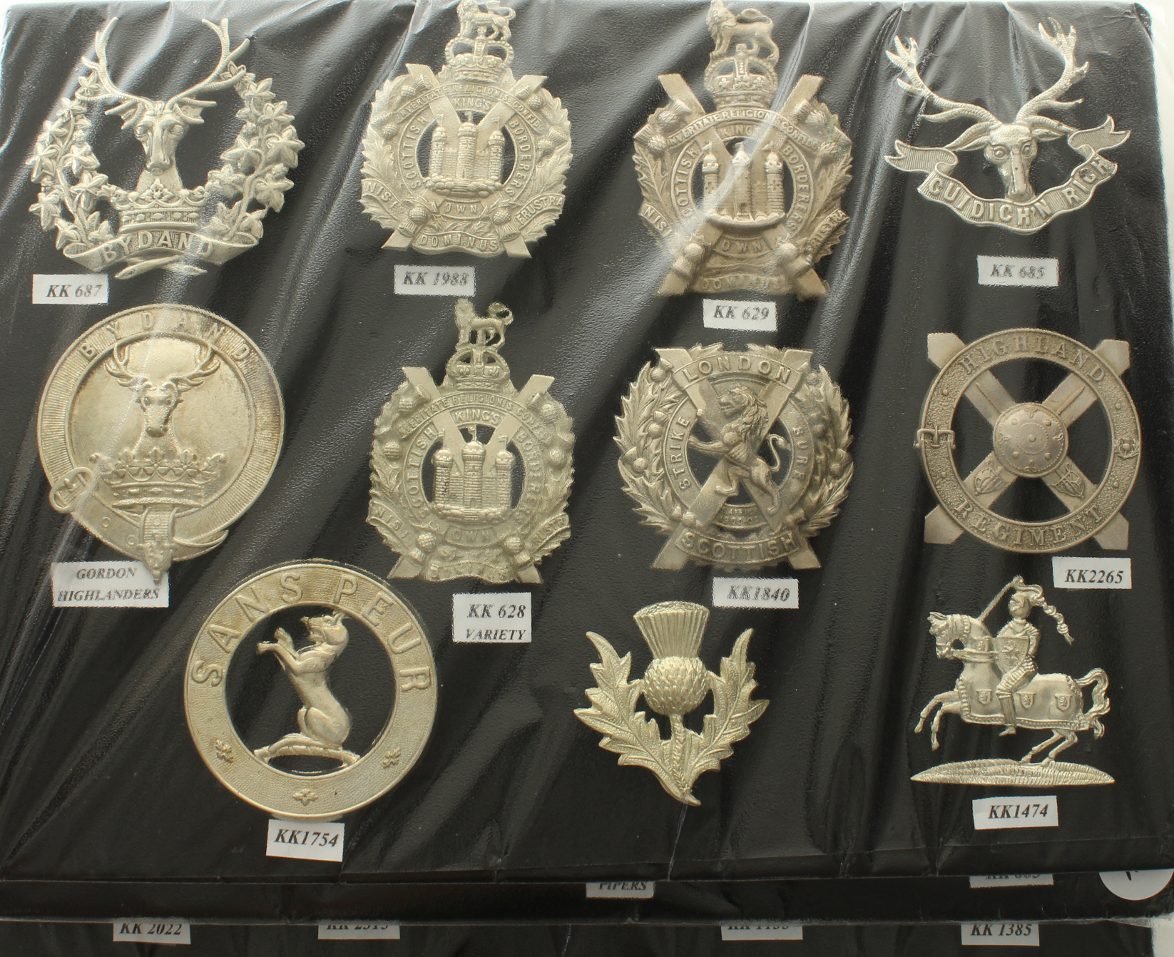Scottish Cap Badges mounted on boards, all different, with KK no's ...