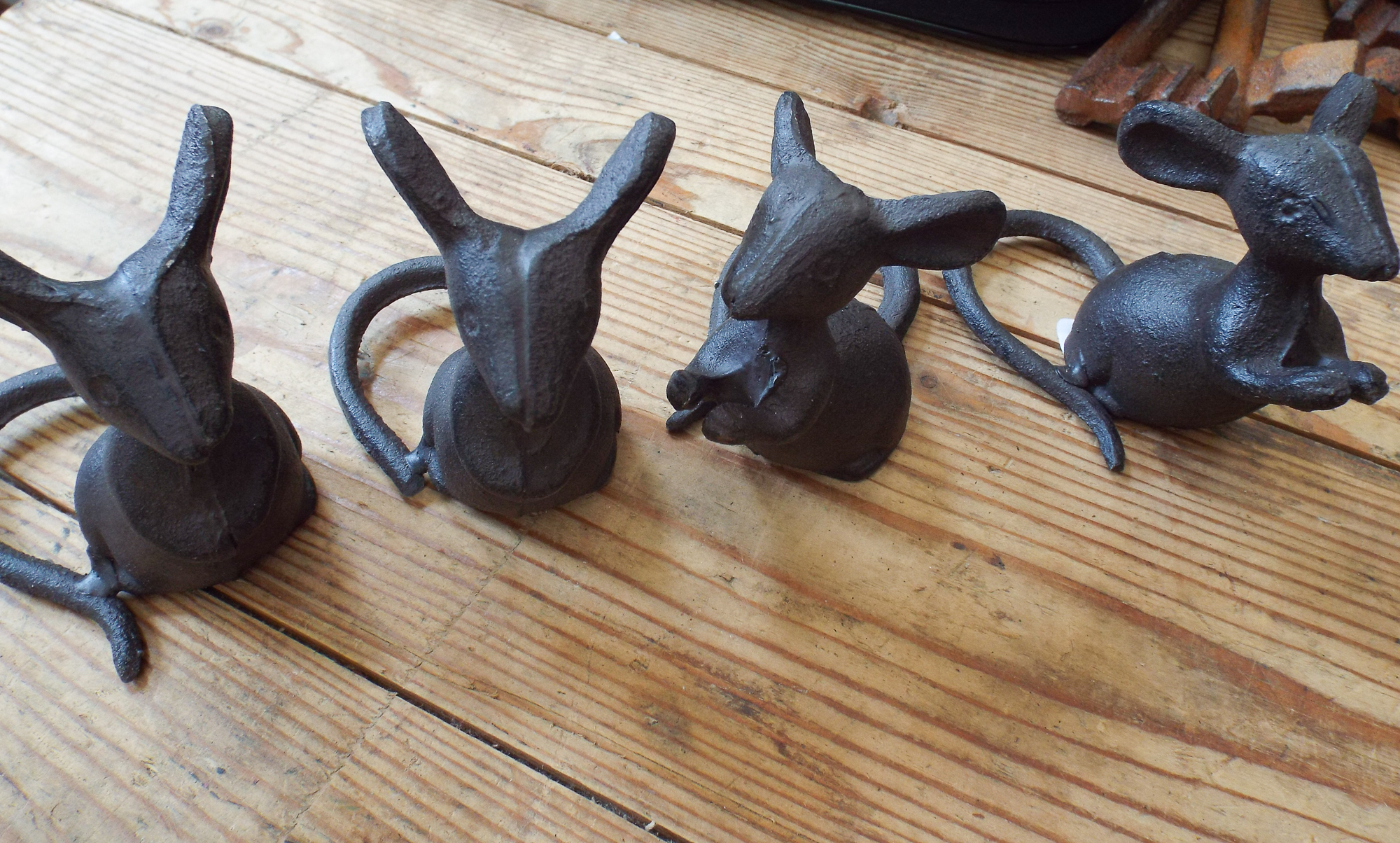 Four cast iron mice