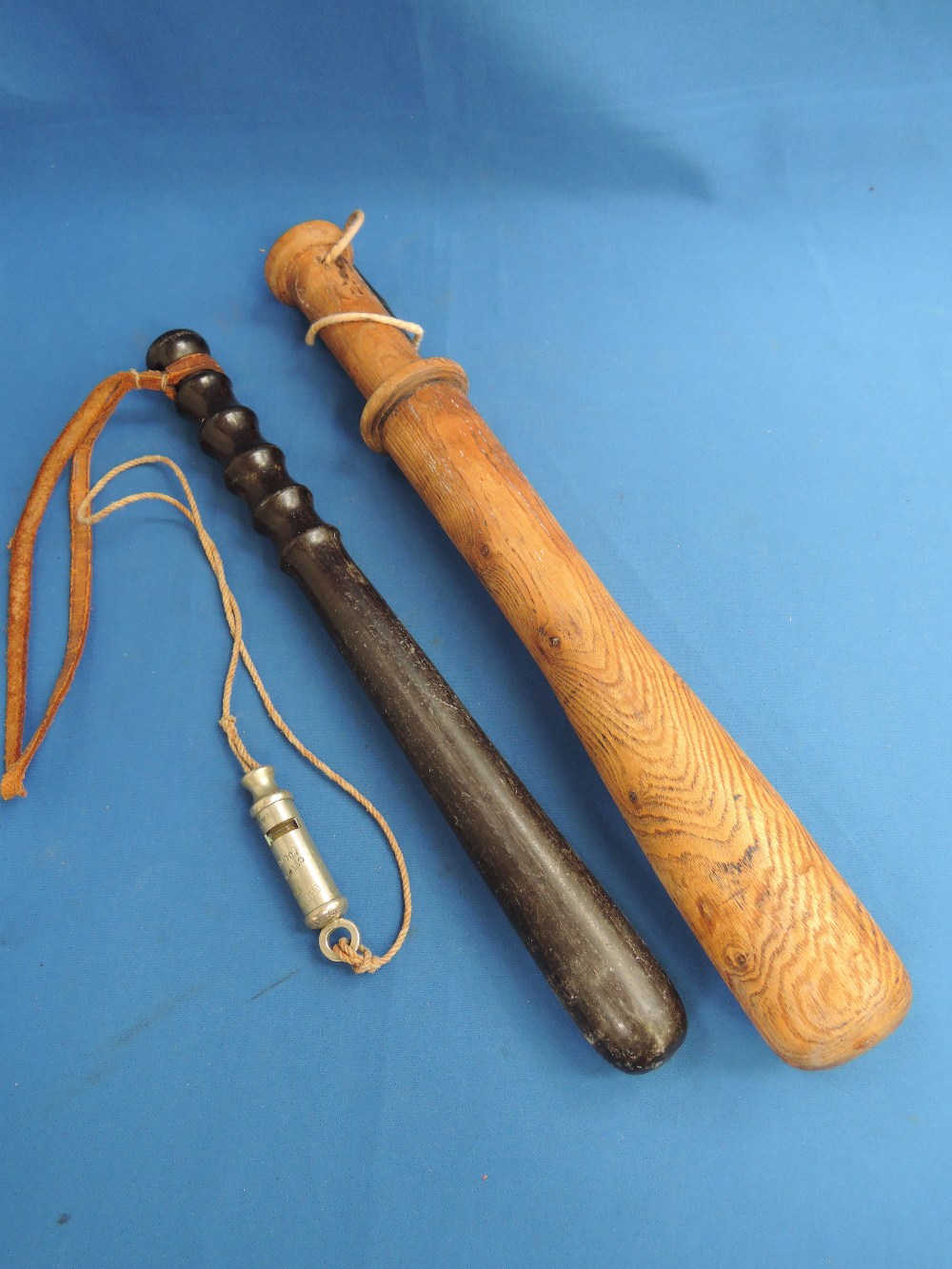 A vintage lignum vitae truncheon of police design and an elm truncheon ...