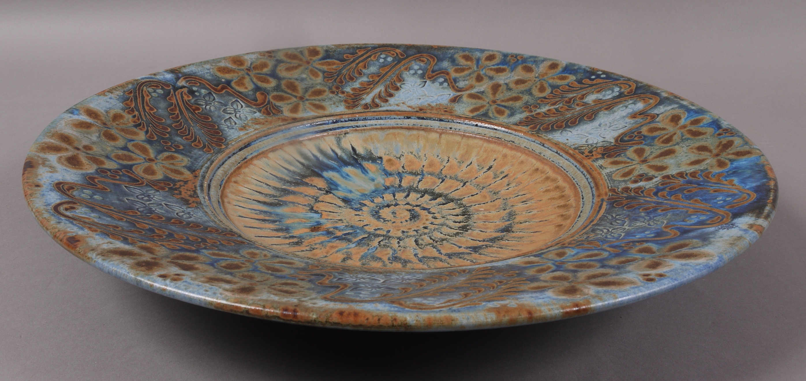 JOHN CALVER, a modern Studio Pottery circular charger, signed 'Calver ...