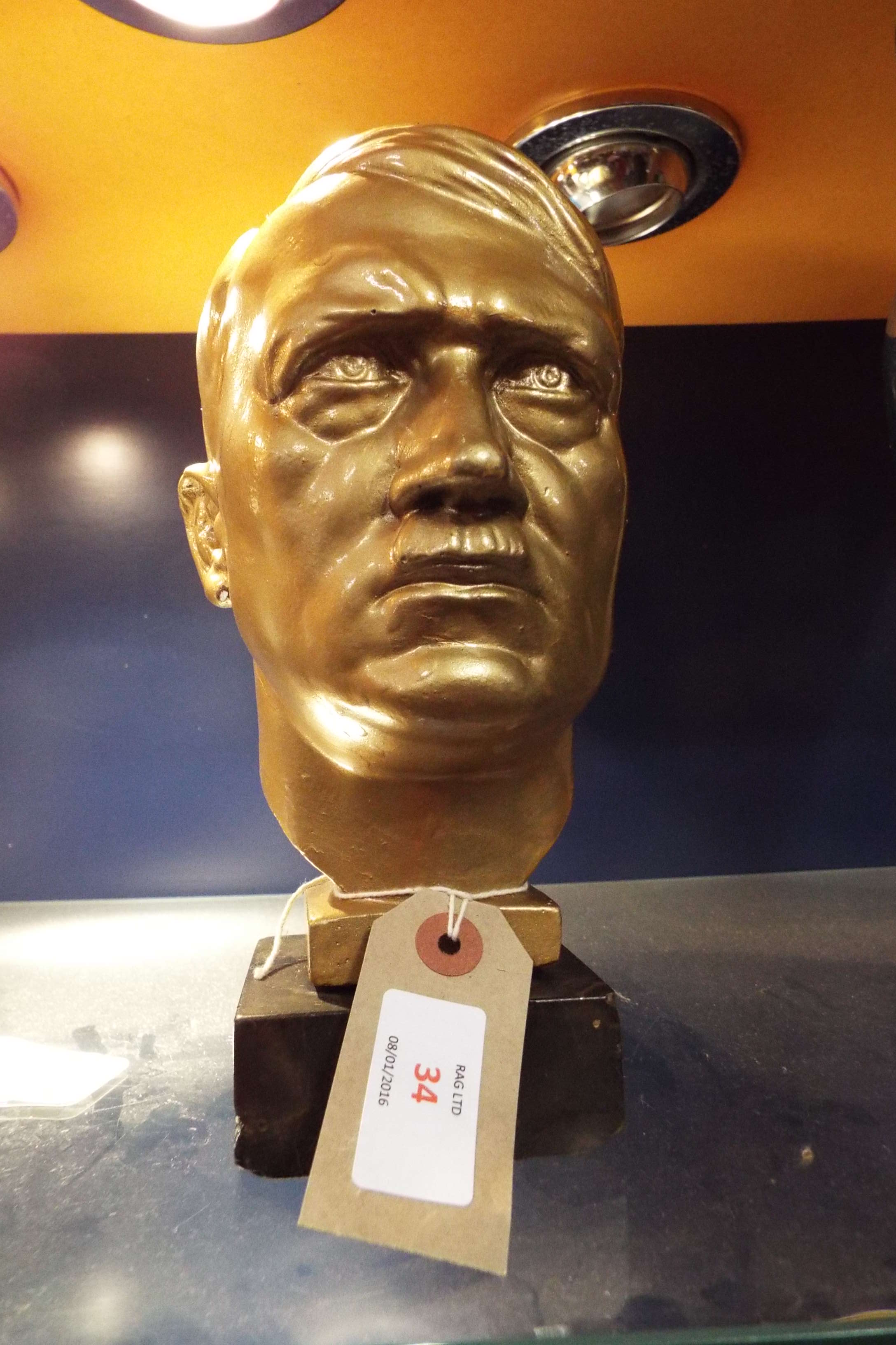 A gilt painted plaster bust of Adolf Hitler indistinctly signed to neck ...