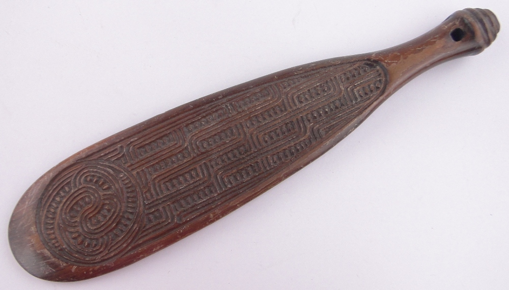 A Maori carved wood Patu tribal club, carved geometric designs, length ...