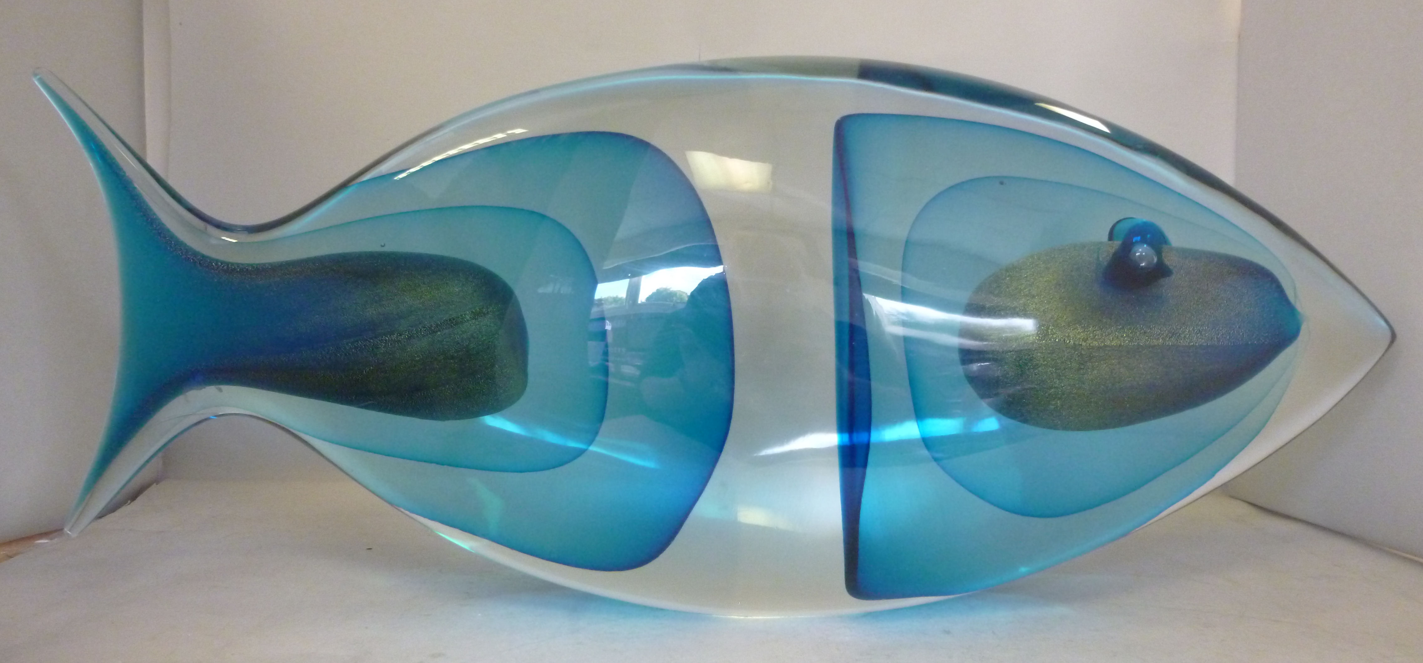 A Romano Dona Murano glass fish sculpture, tinted in shades of ...