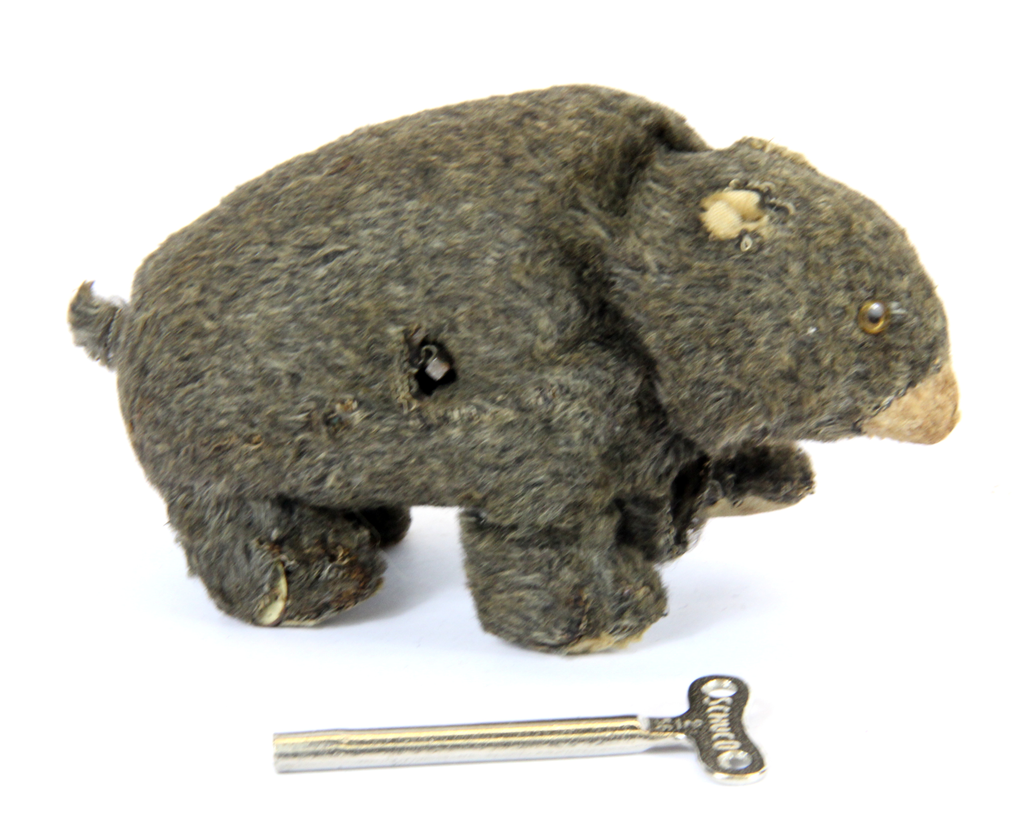 A vintage mechanical toy bear, L. 13cm.