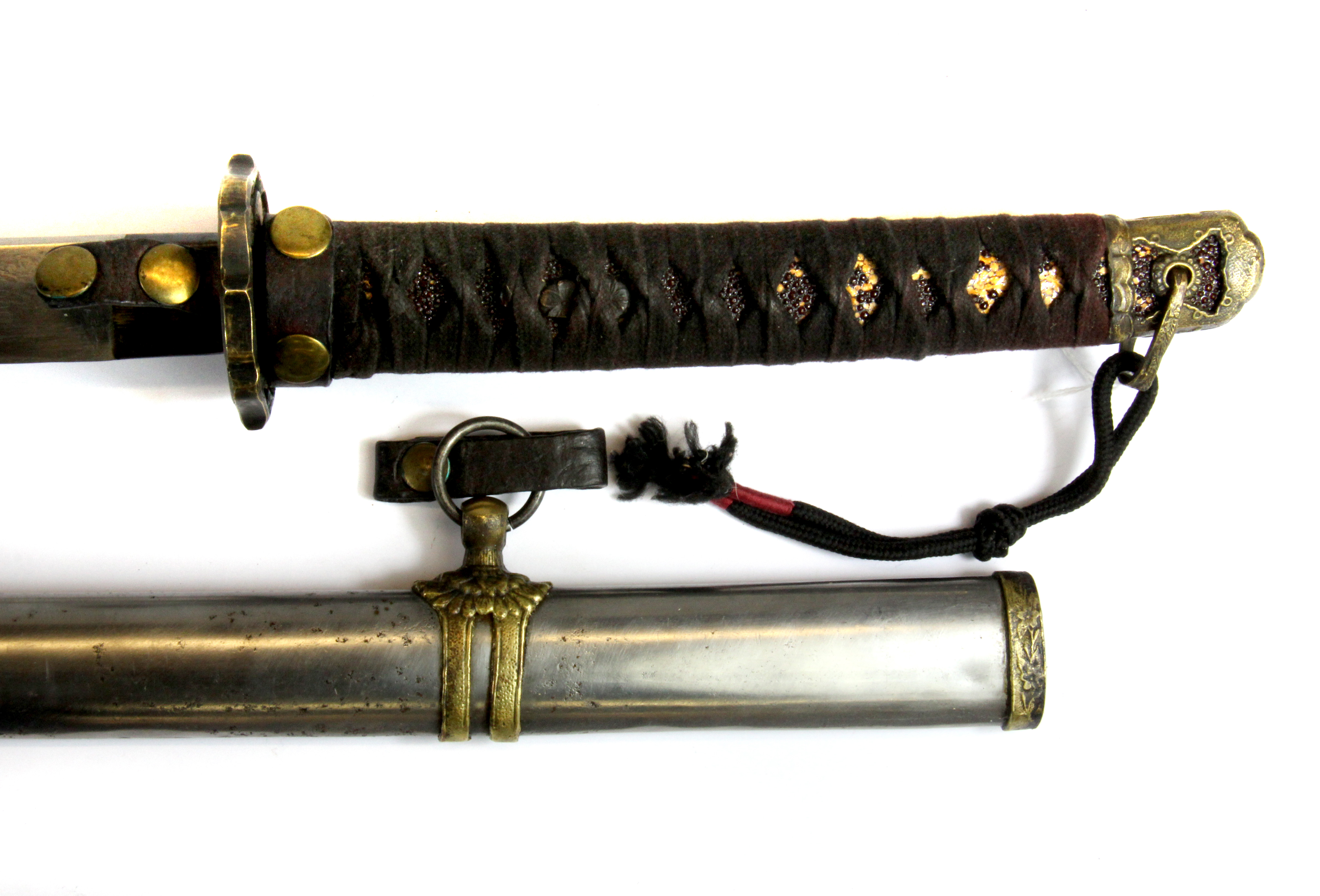 A Japanese shin gunto sword with polished steel and brass mounted ...
