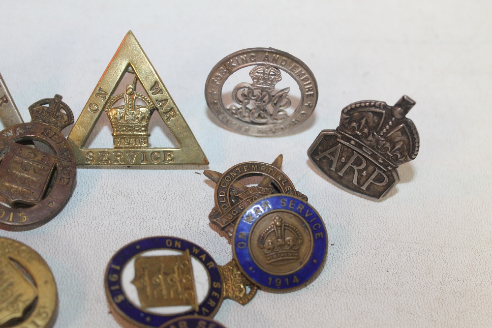 THREE WWI BADGES, six "On War Service" badges (1914/15/16), two HM ...