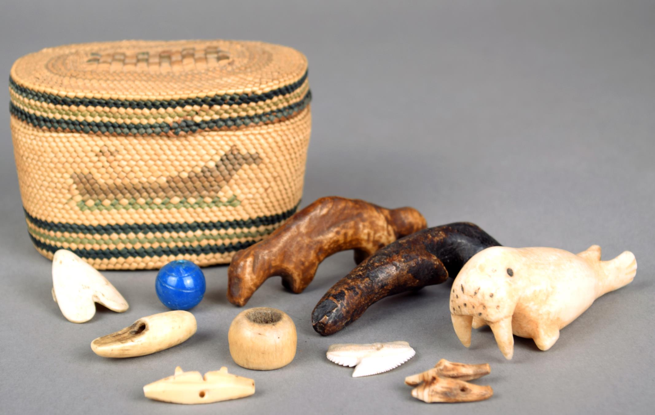 An Inuit walrus amulet Alaska walrus ivory and baleen, 7.5cm long, two ...