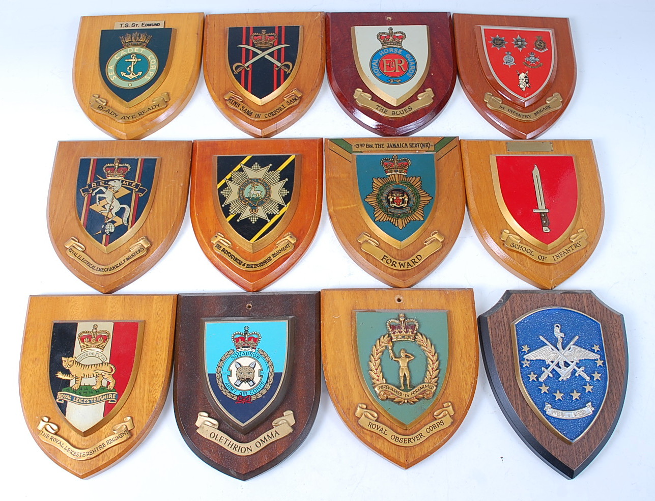A collection of regimental wall plaques to include Essex Regiment ...