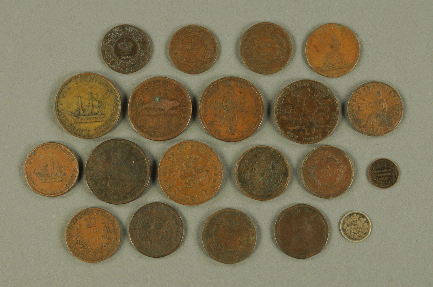 Twenty British colonial copper tokens, 18th and 19th century, to ...