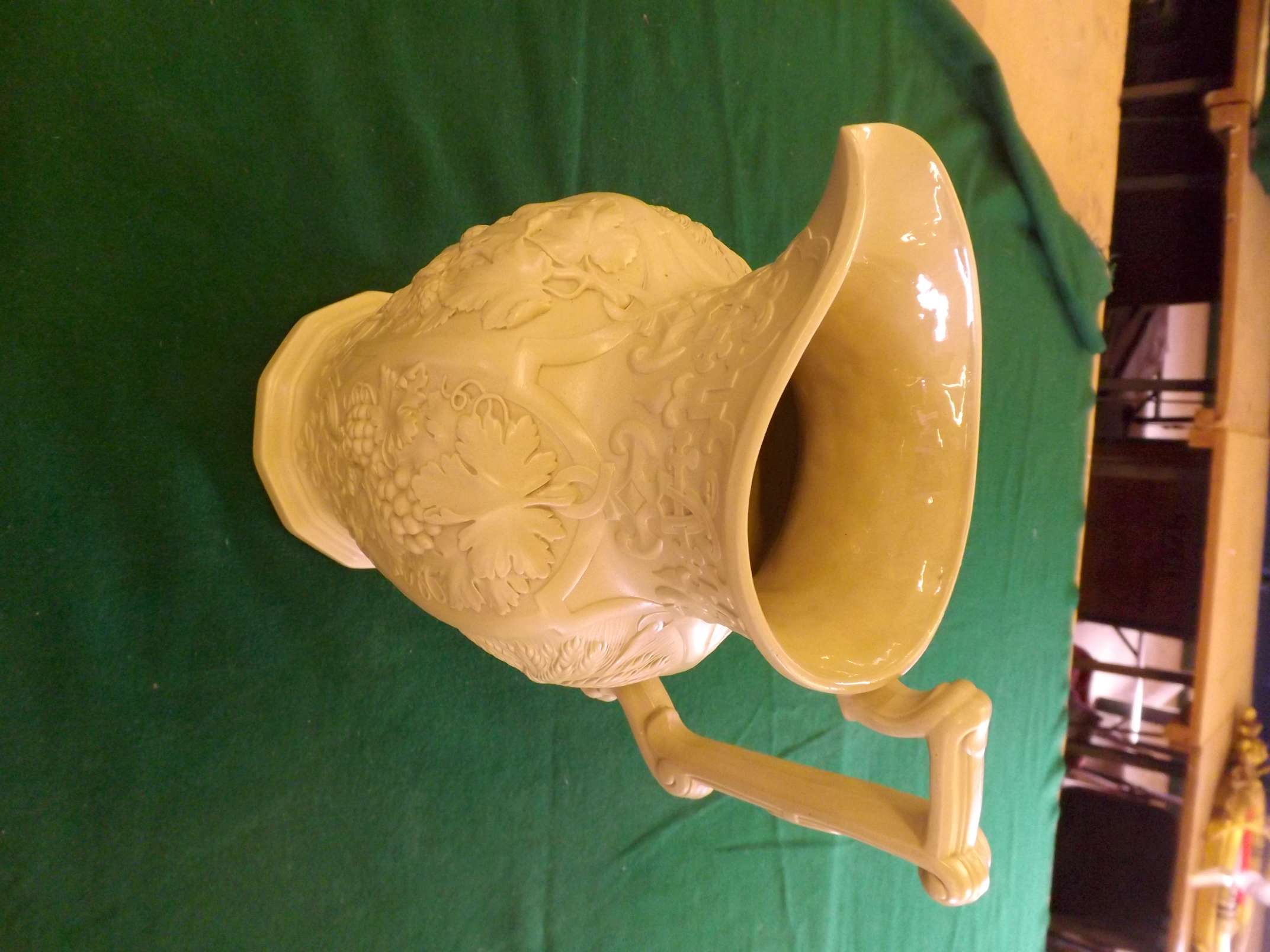 A fine quality Victorian pottery relief ware wine jug with grape and ...