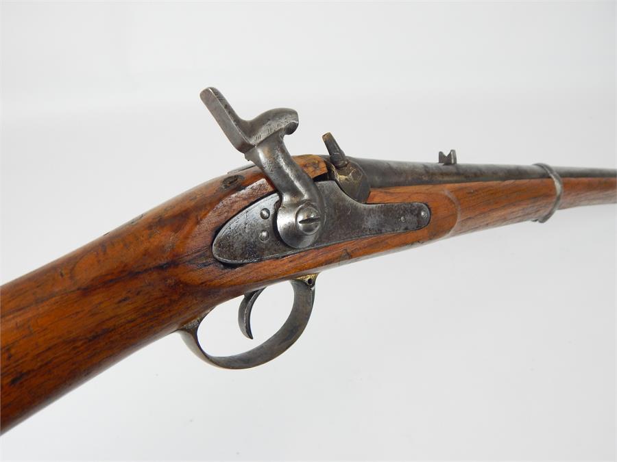 A three-band percussion cap musket with brass mounts and steel ram rod.