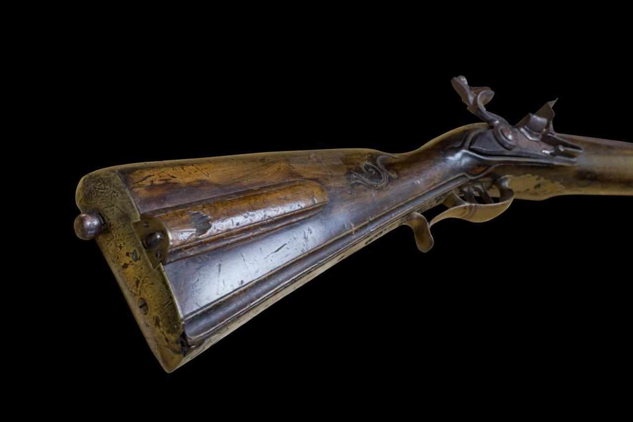 A HEAVY FLINTLOCK RIFLE, 18TH CENTURY Origin: Central or Western Europe ...