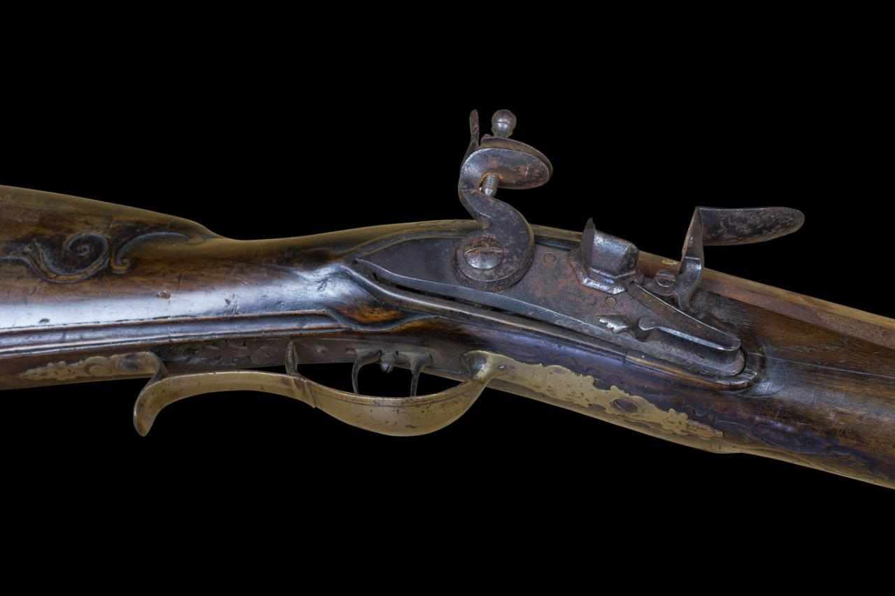 A HEAVY FLINTLOCK RIFLE, 18TH CENTURY Origin: Central or Western Europe ...