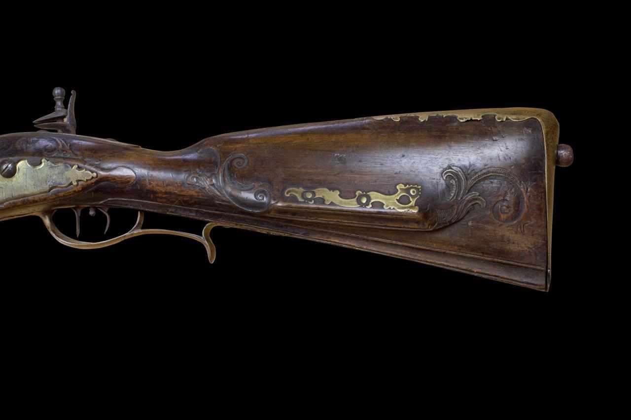 A HEAVY FLINTLOCK RIFLE, 18TH CENTURY Origin: Central or Western Europe ...