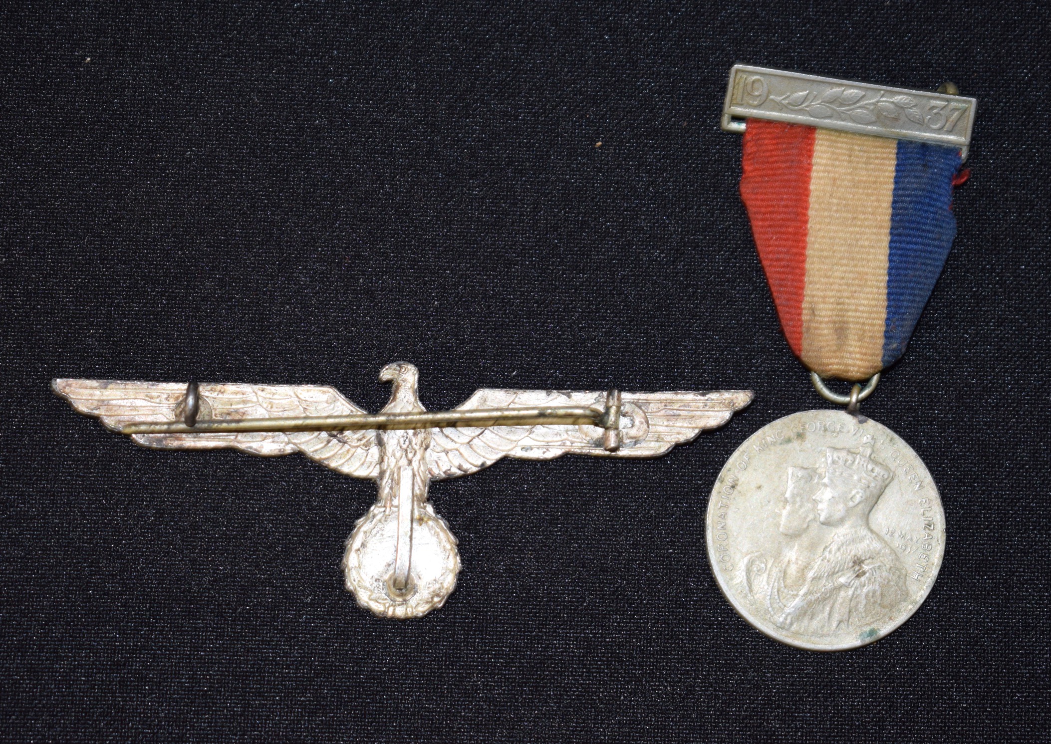 A NAZI MEDAL, together with another medal. (2)