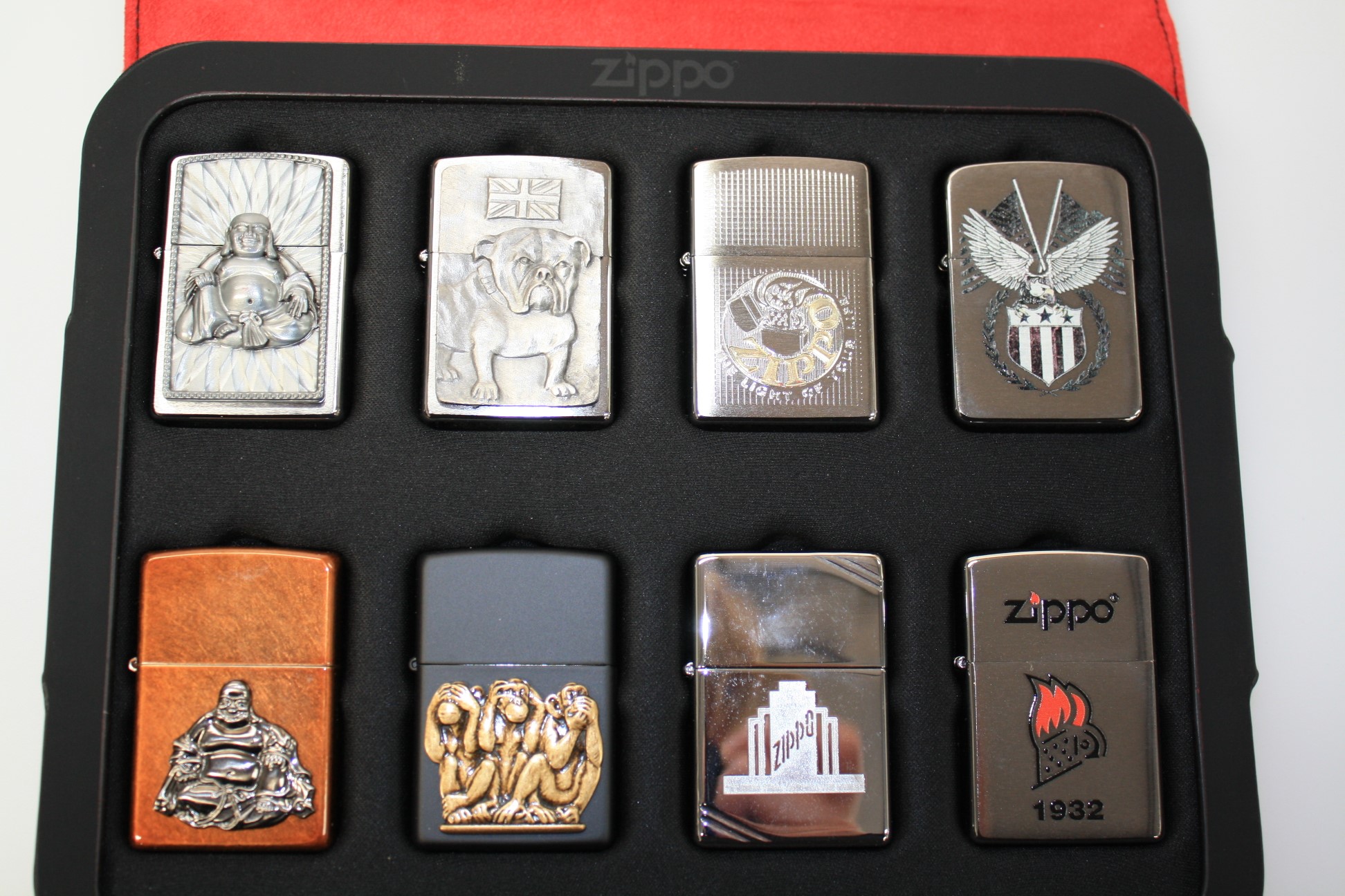 A LARGE COLLECTION OF ZIPPO LIGHTERS, approximately 155 in Zippo cases.