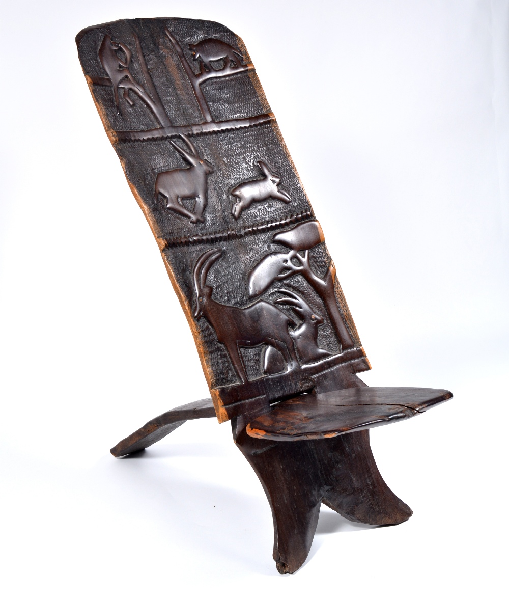 African tribal birthing chair carved with animals 104cm high.