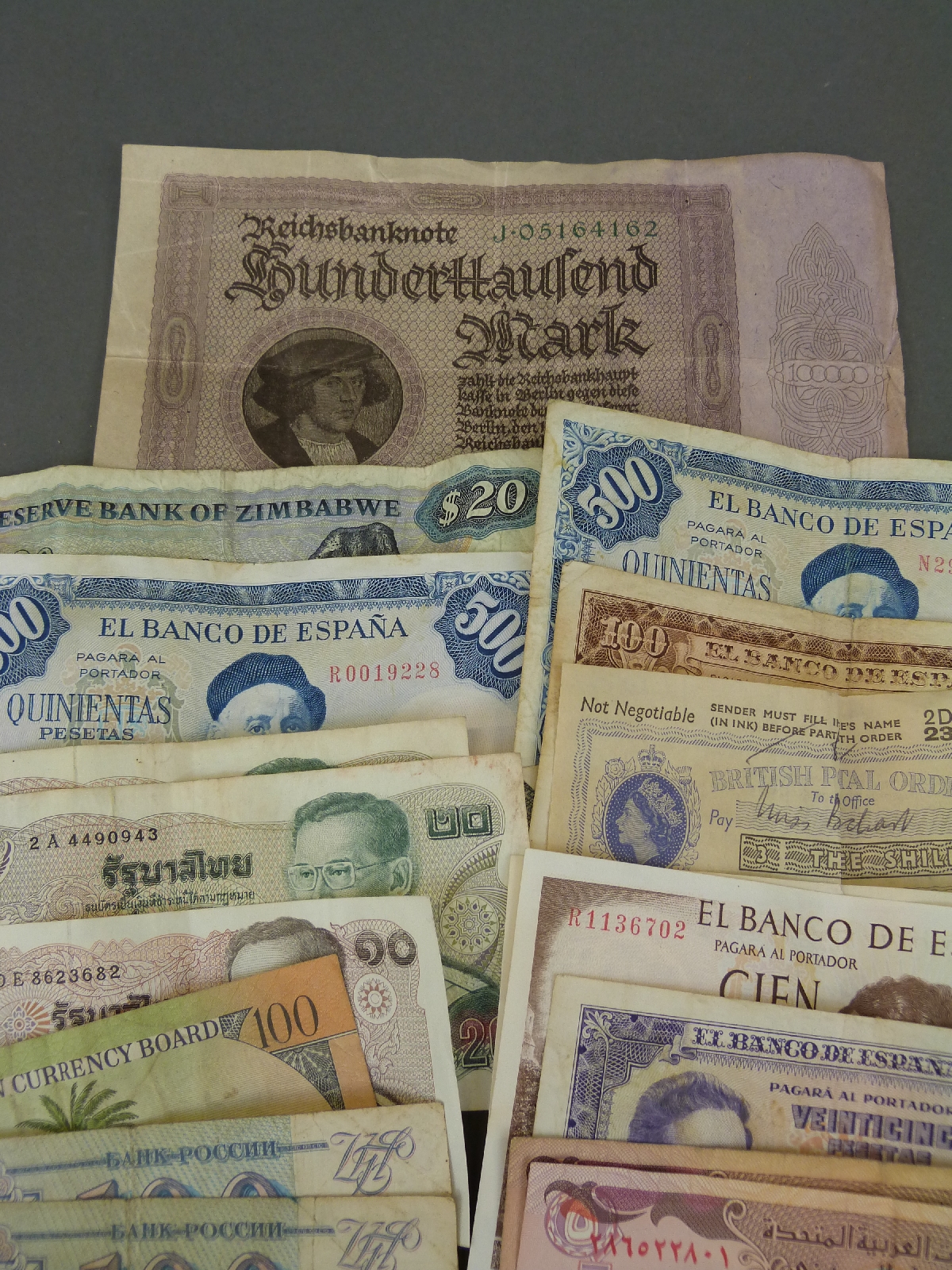 A collection of world bank notes in used condition, but some still ...