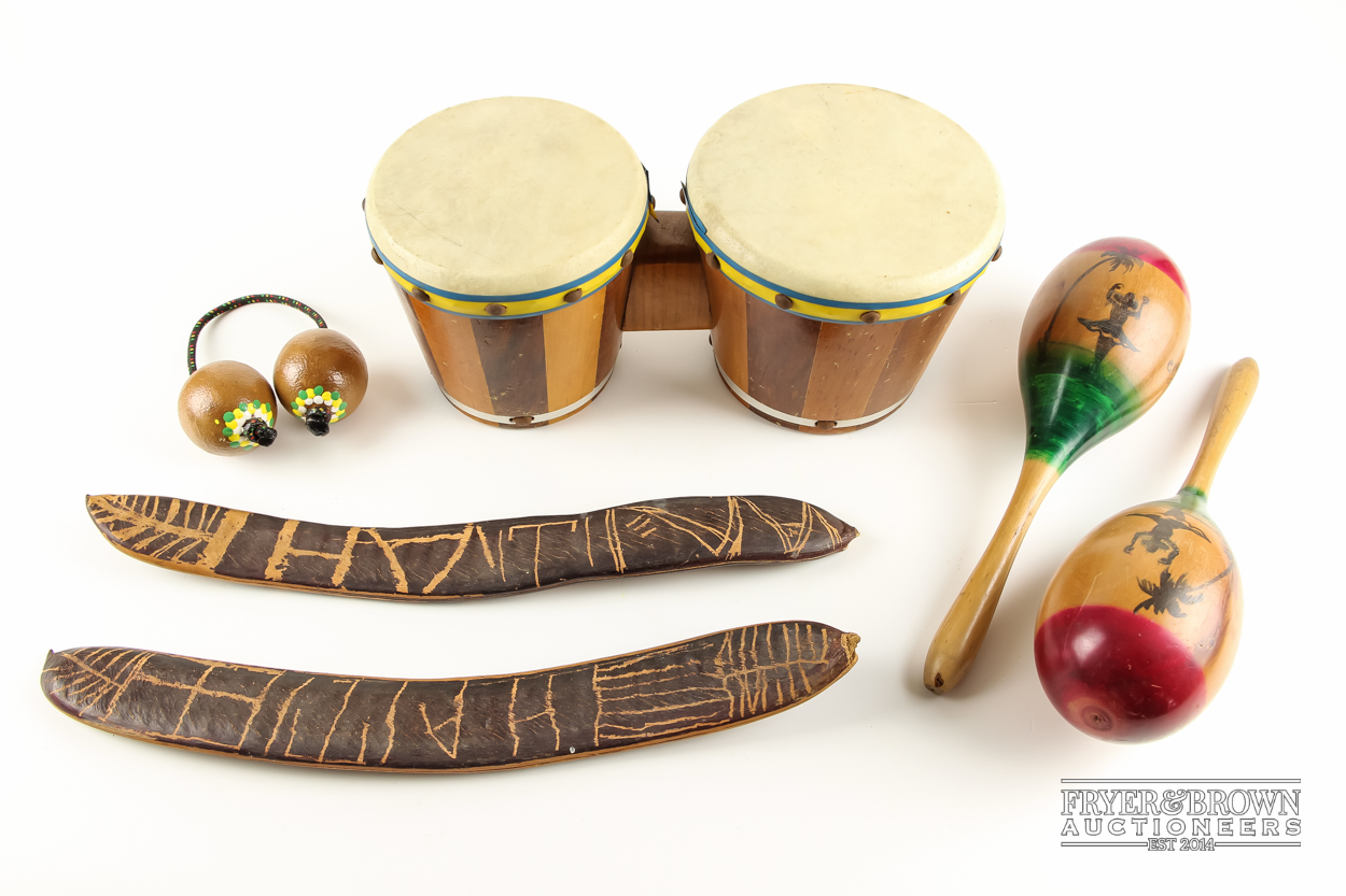 A small quantity of percussion instruments, including bongos, maracas ...