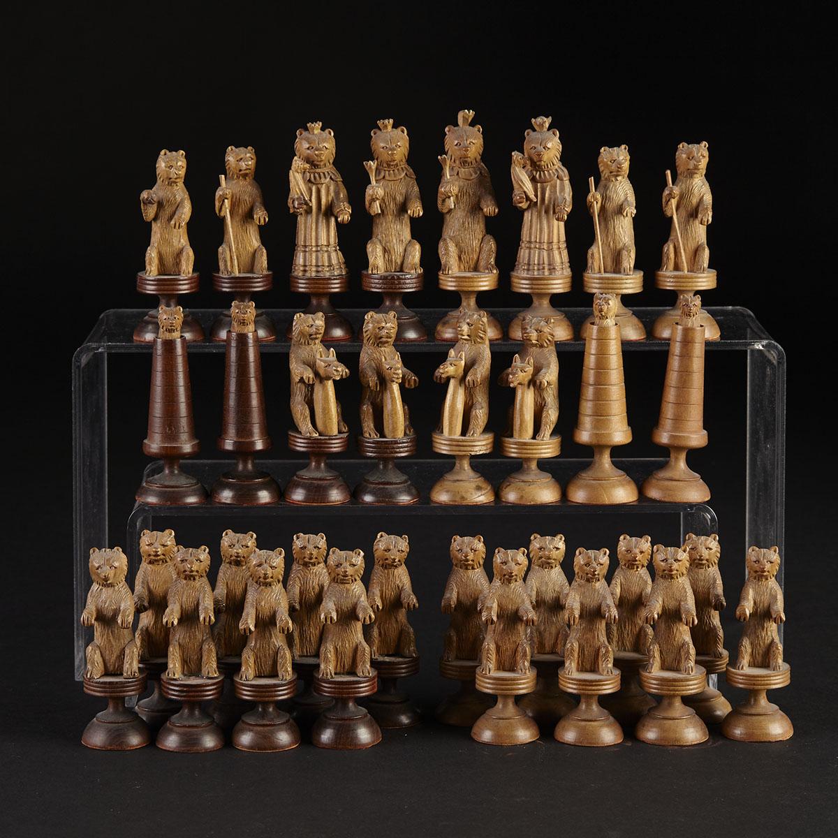 SWISS CARVED SOFTWOOD ‘BEARS OF BERNE’ CHESS SET, 20TH CENTURY one side ...