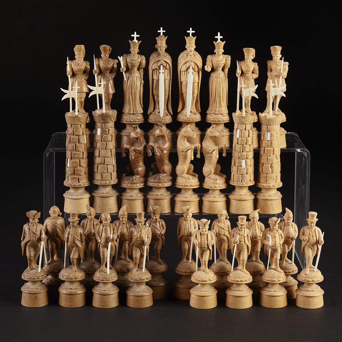 SOUTH GERMAN CARVED LIMEWOOD AND IVORY ‘CHARLEMAGNE’ FIGURAL CHESS SET ...