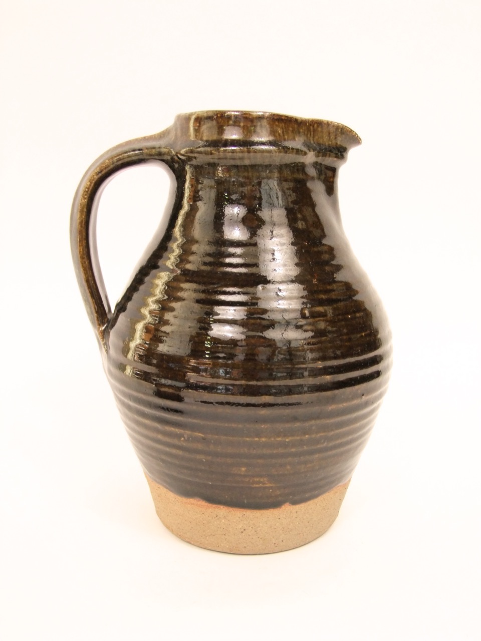 A large studio pottery jug by David Leach with brown glazed finish ...